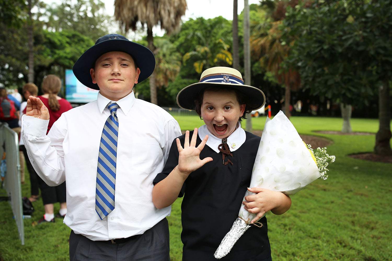 Prince Charles and Camilla visit Brisbane, well-wishers brave wet ...