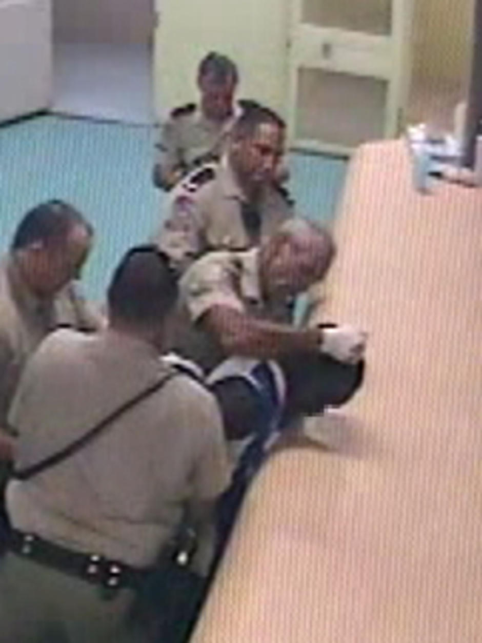 Video shows cop pushing man's head into counter - ABC News