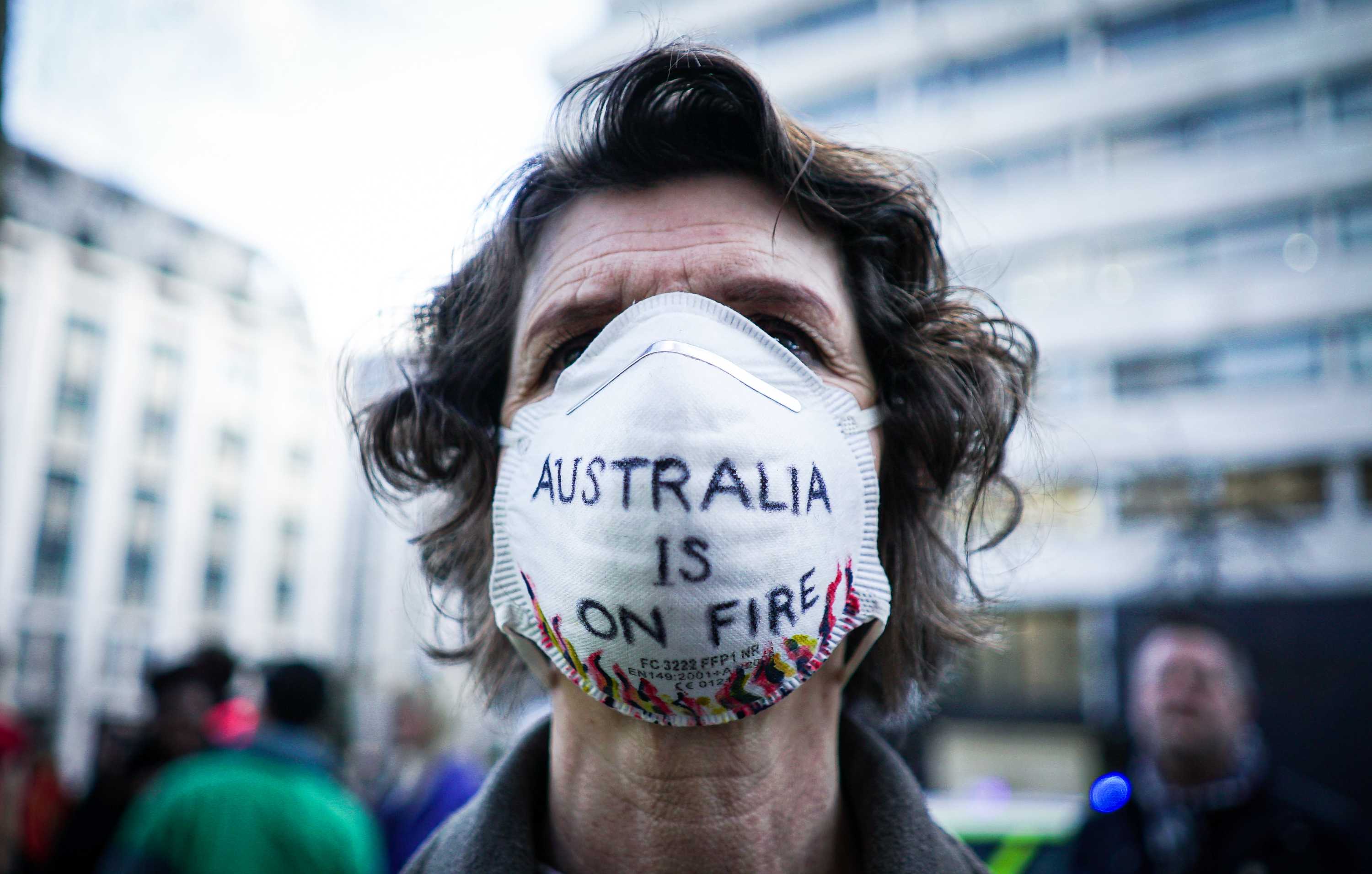 Climate action protesters angry over Australia's bushfires rally across ...