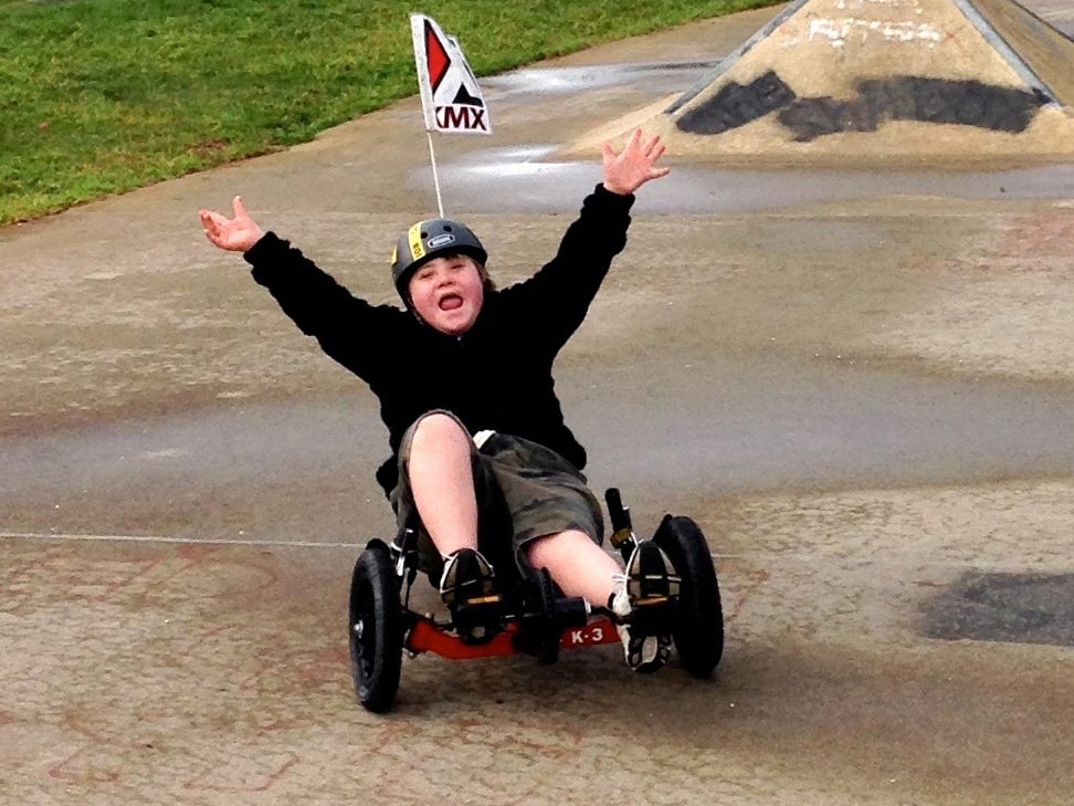 Boy with Down syndrome completes epic bike ride for charity - ABC News