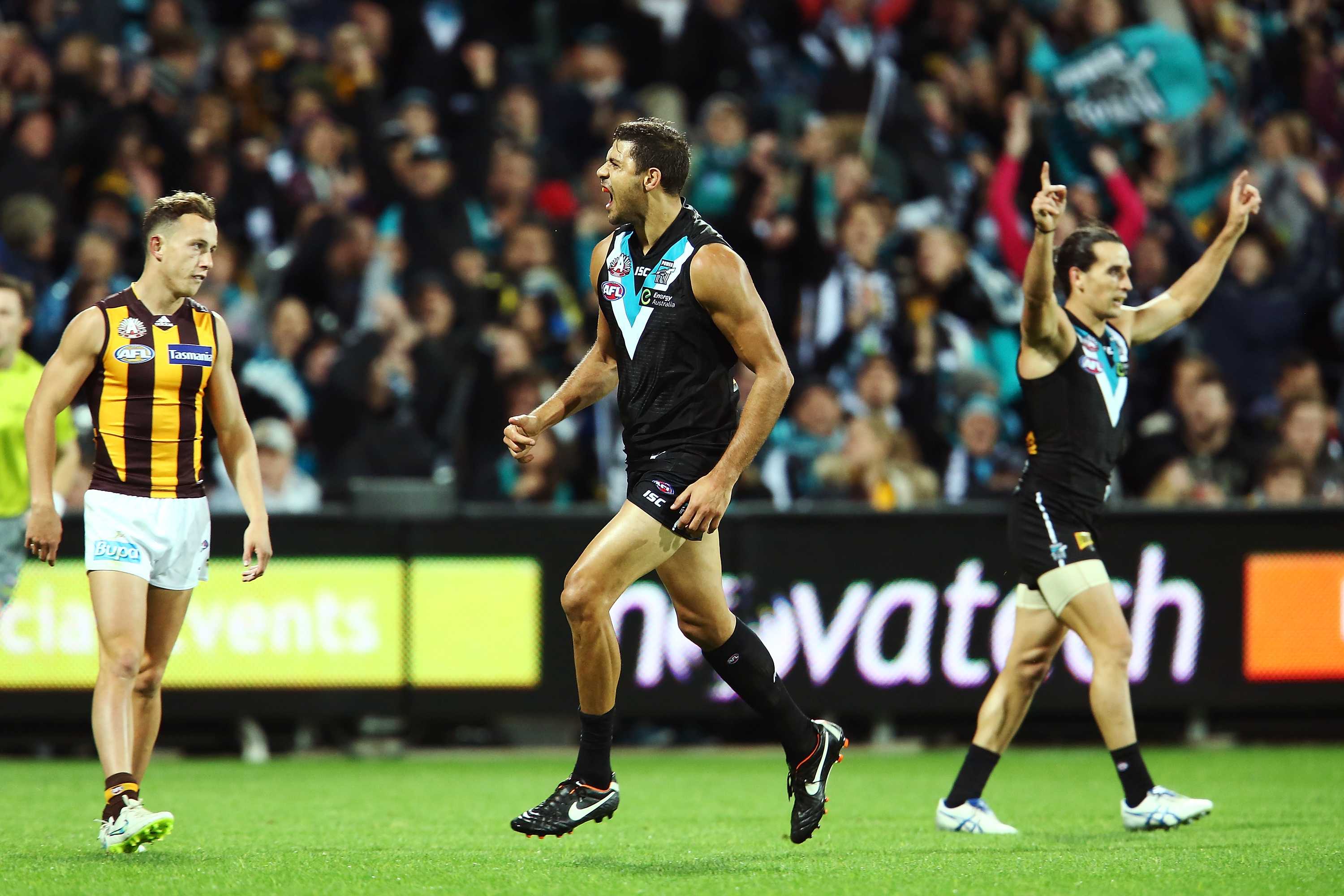 Port Adelaide beats Hawthorn by eight points after premiers produce ...