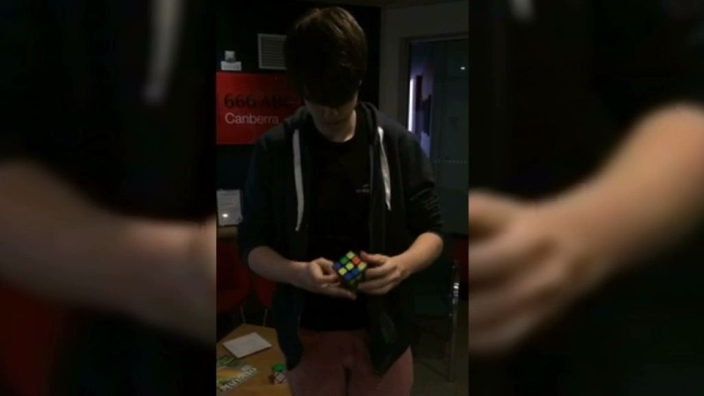 Canberran Jayden McNeill solving a Rubik's Cube - ABC News