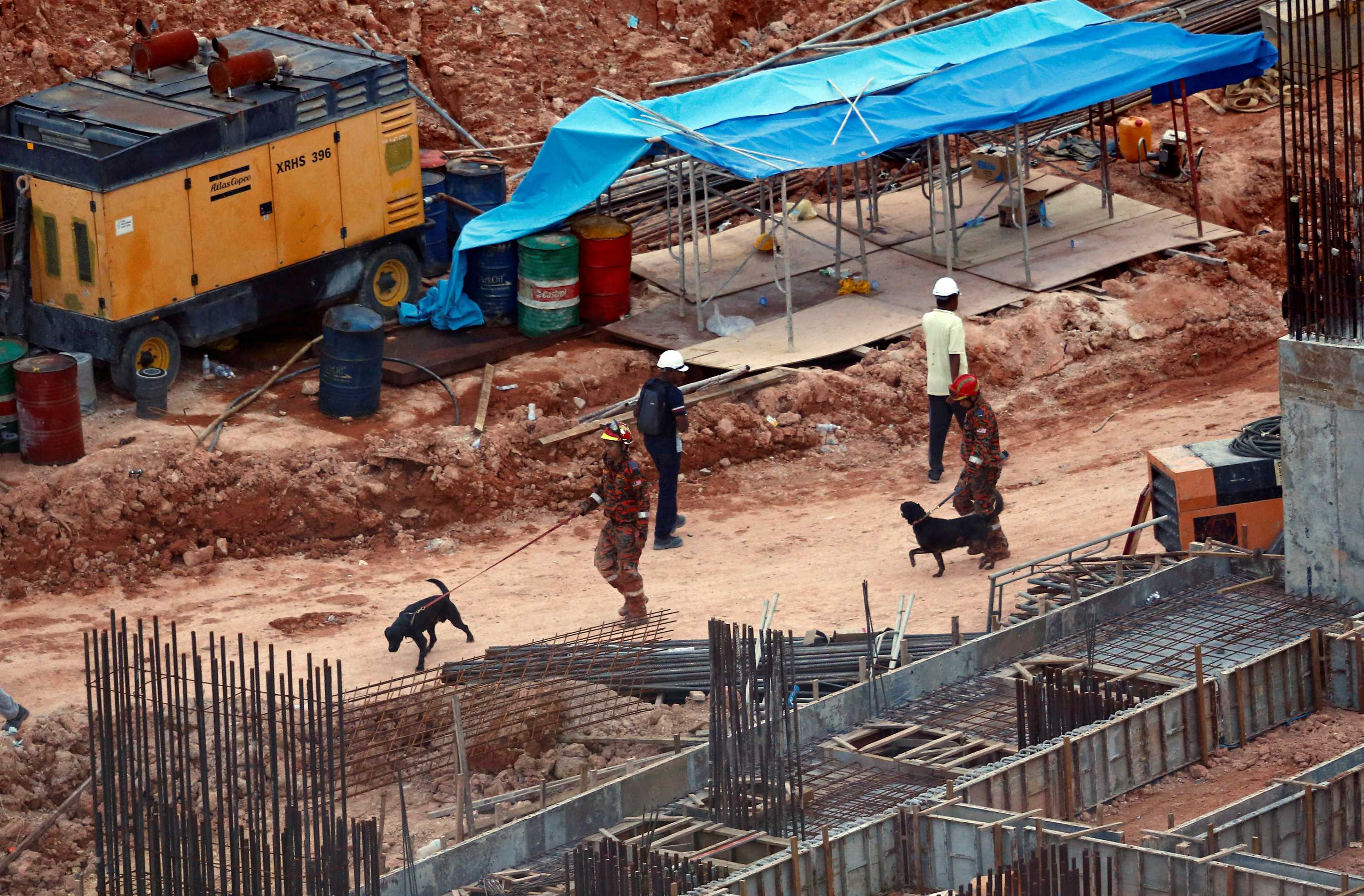 Lethal landslide at Malaysia construction site kills 11 foreign workers ...