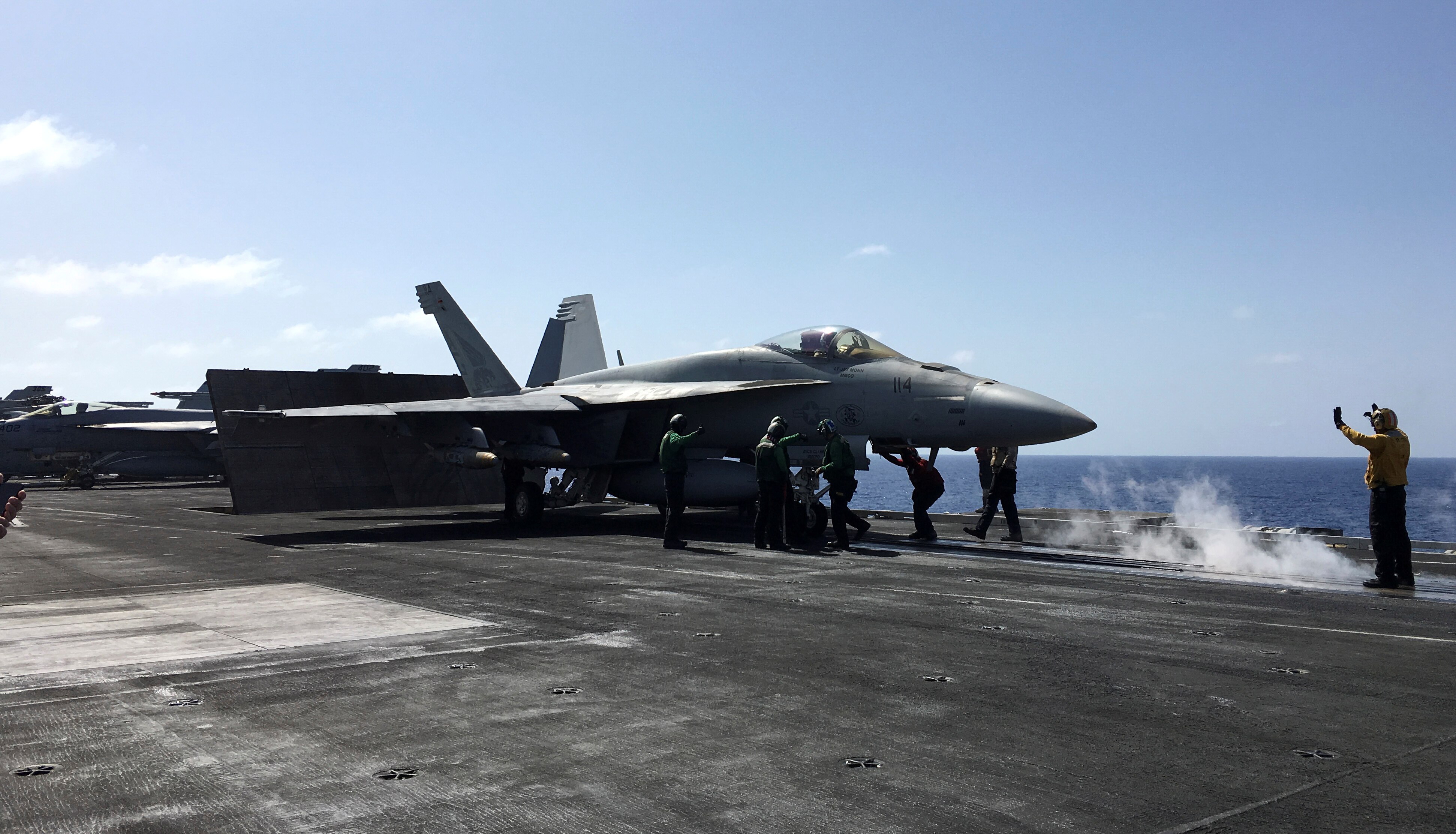 F-18 jet fighter slips off deck of US aircraft carrier deployed to Red ...