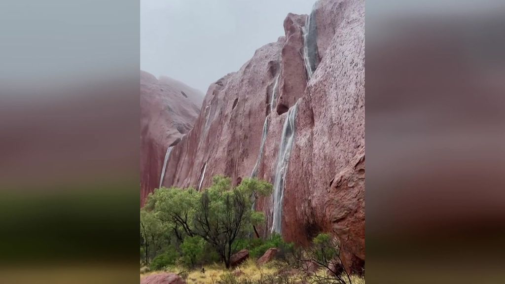 Uluru waterfalls spring to life due to heavy rainfall - ABC News