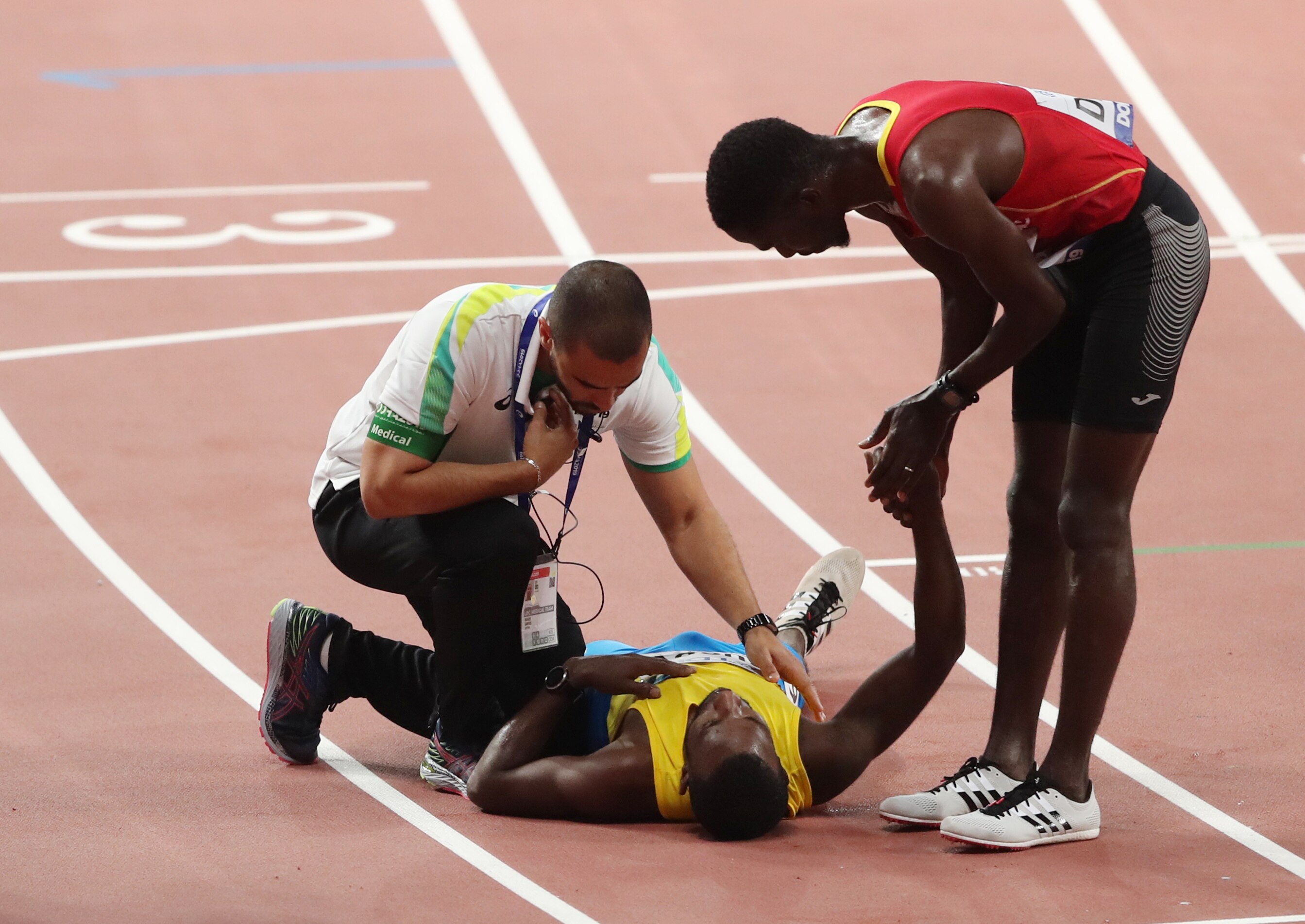 World championships athlete Suncar Dabo helps rival Jonathan Busby ...