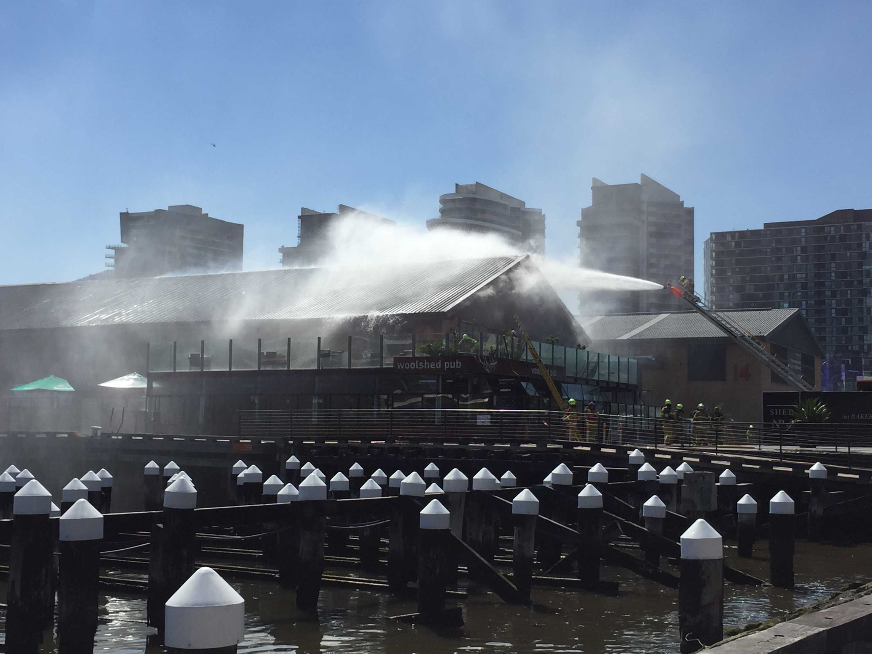 Docklands blaze: Crews mopping up after huge fire at Wool Shed pub ...