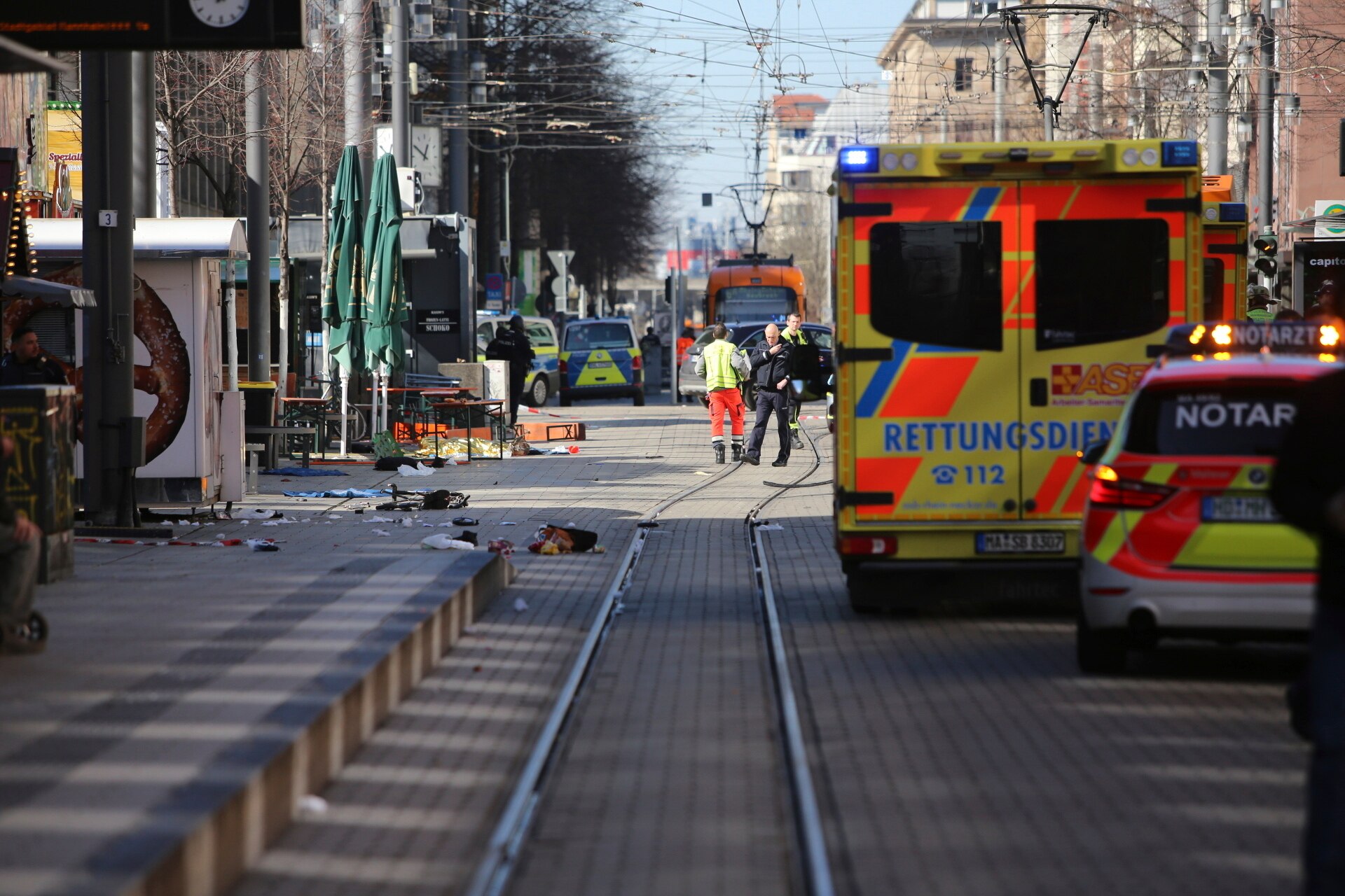 Two people dead and driver arrested after car drives into crowd in ...