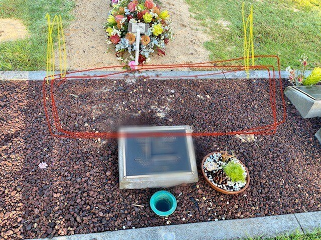 Ashes 'dug up' after another person buried in same cemetery plot ...