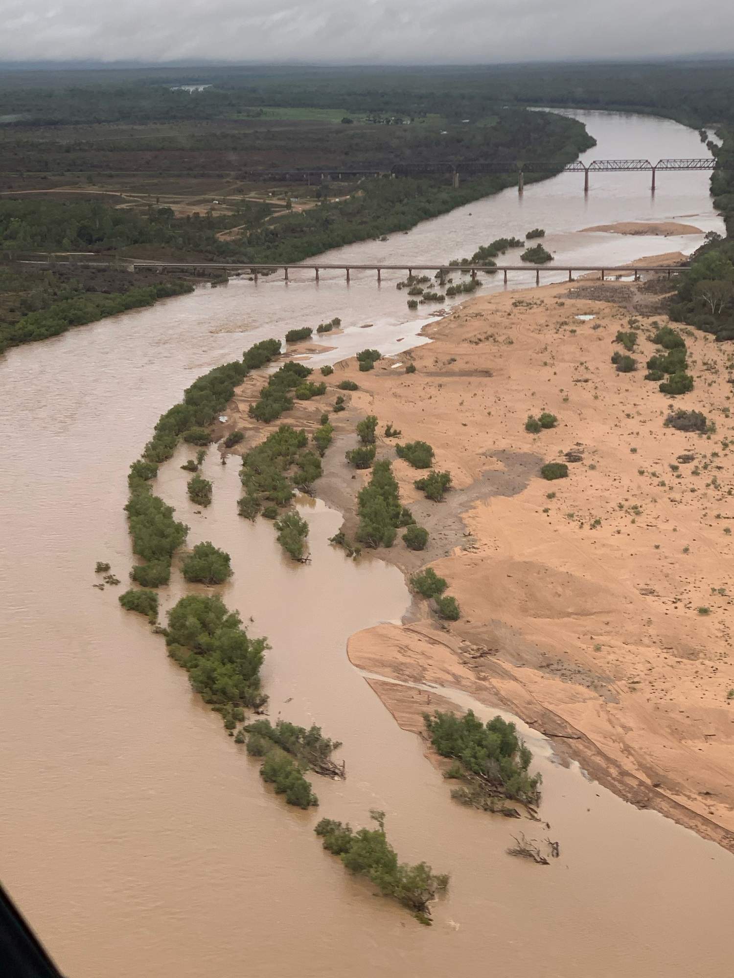 Deluge continues in north Queensland with towns on flood watch after ...