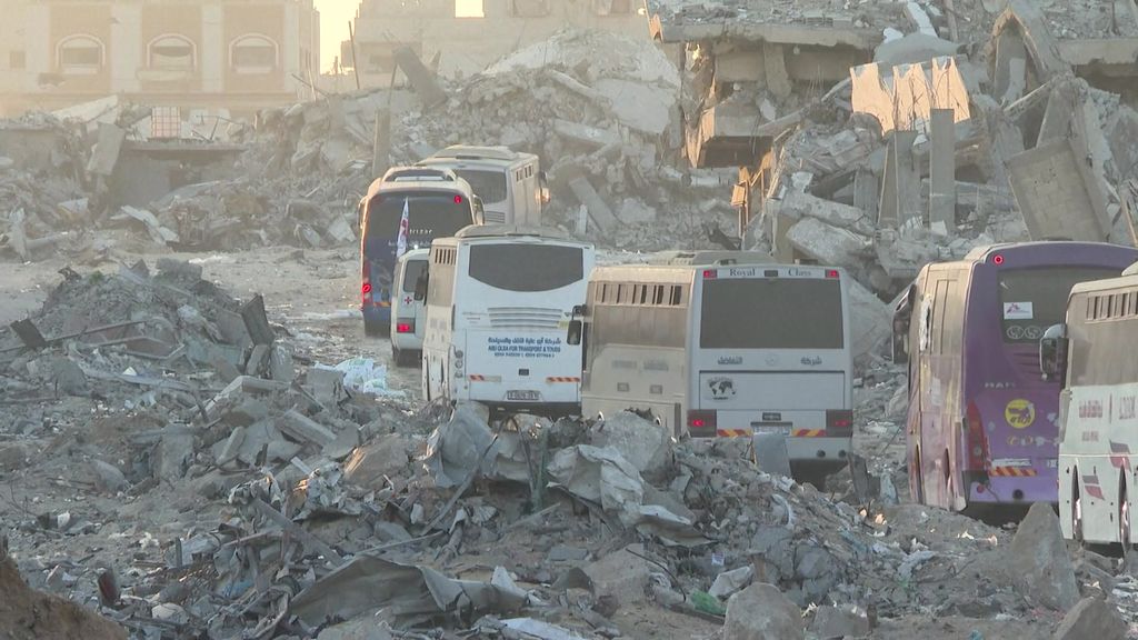 Convoy of Red Cross buses drive through devastated Gaza cityscape - ABC ...