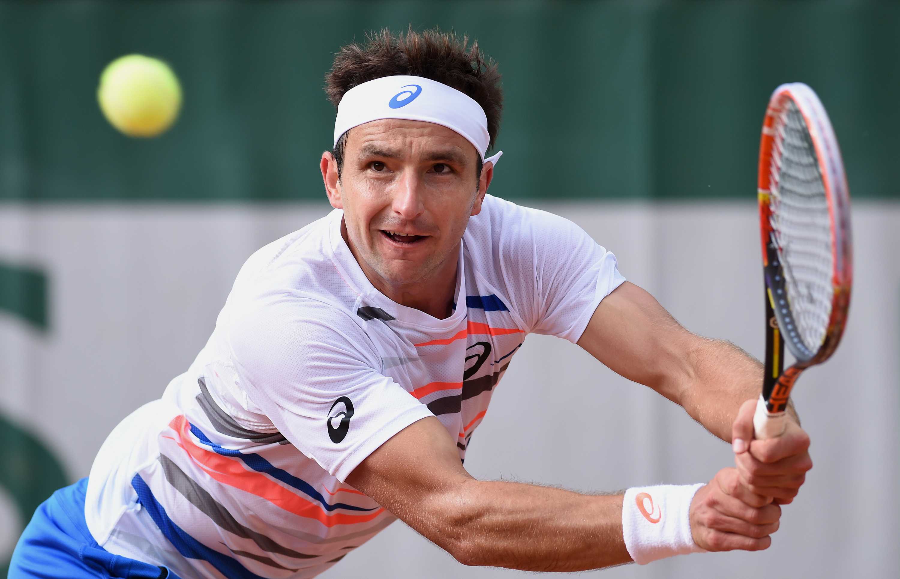 Marinko Matosevic breaks grand slam duck to beat Dustin Brown in French ...