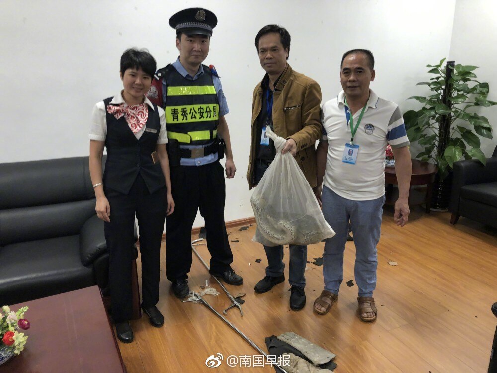Python drops from ceiling during a staff meeting at China bank - ABC News