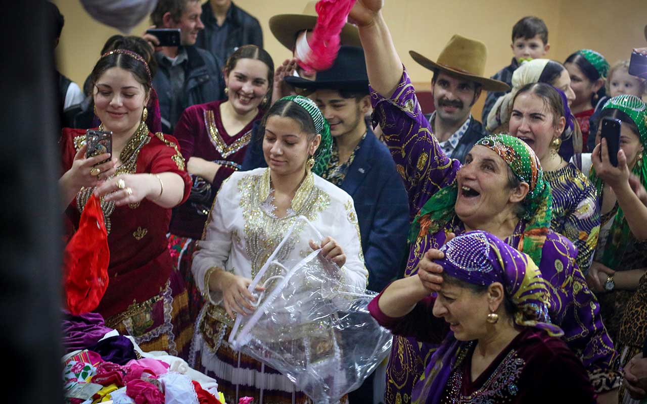 Roma gypsies dance in celebration inside a community hall in ...