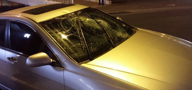 Trolleys hurled at vehicles: Woman injured after car's windscreen ...