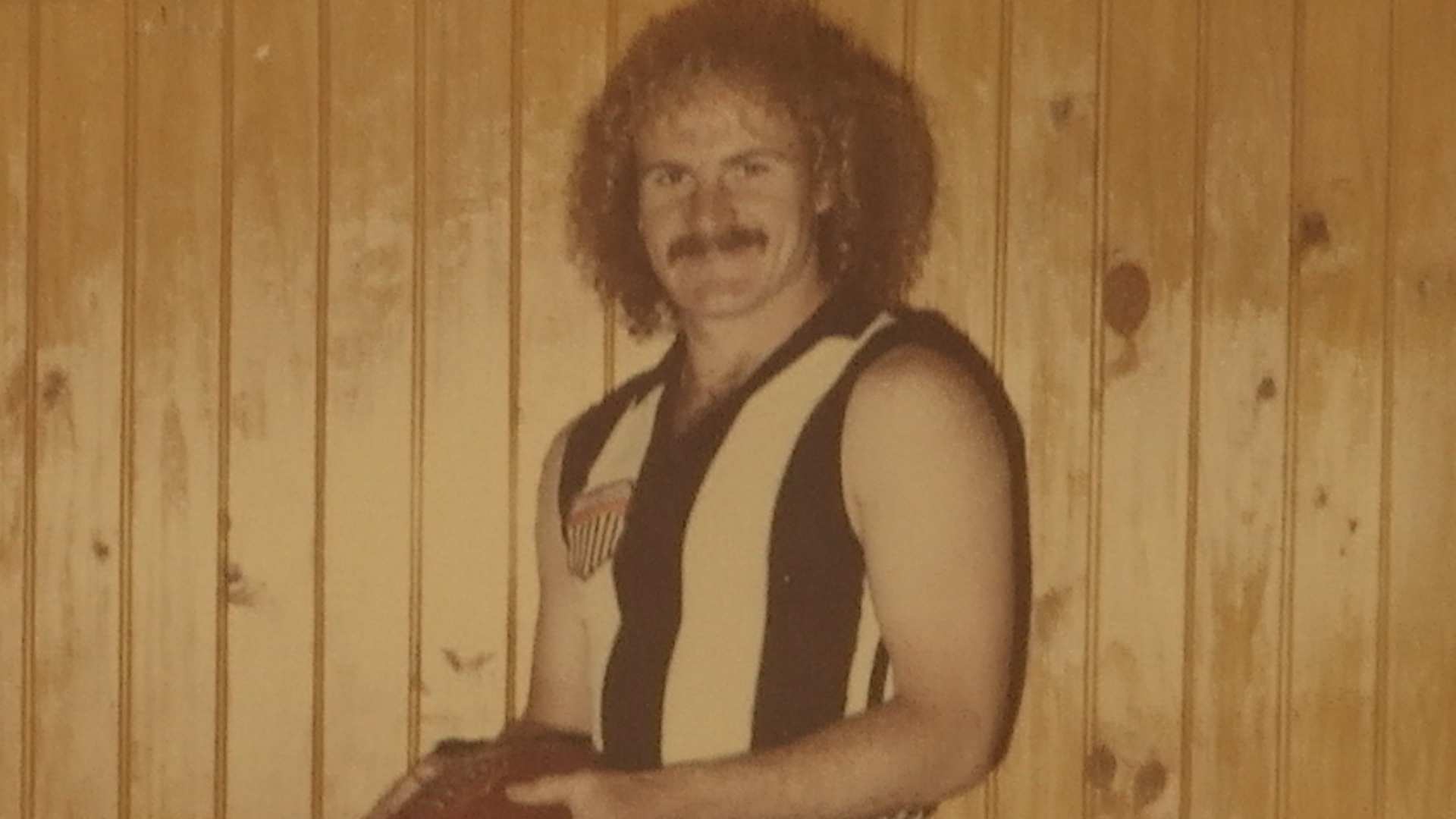 Wearing legend dad's footy jumper provides special connection for ...