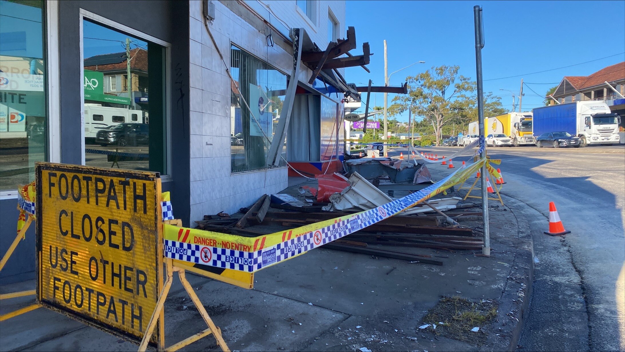Pacific Highway closed for five hours after truck smashes into ...