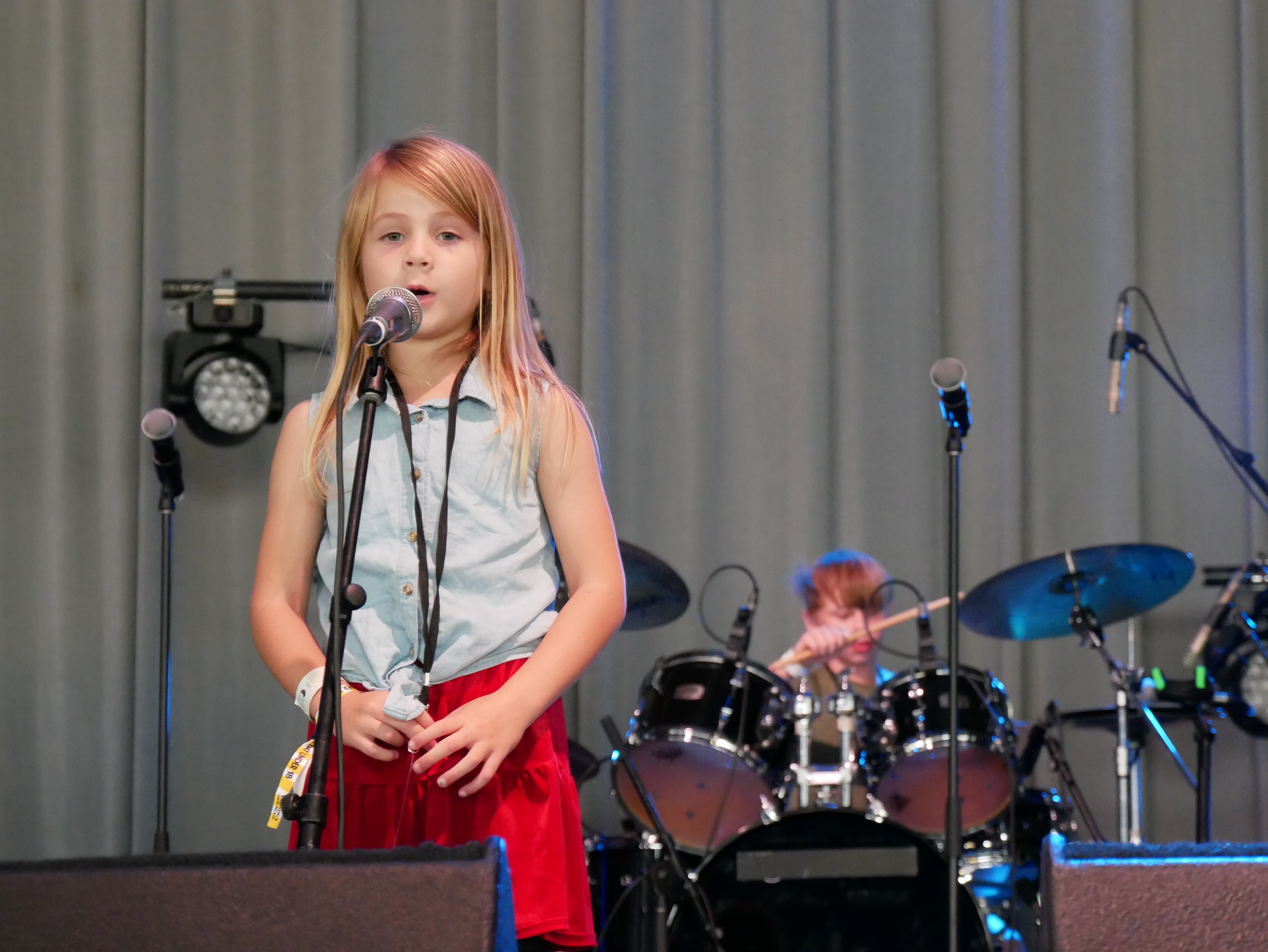 Young students perform on stage at Bluesfest after devastating fires ...