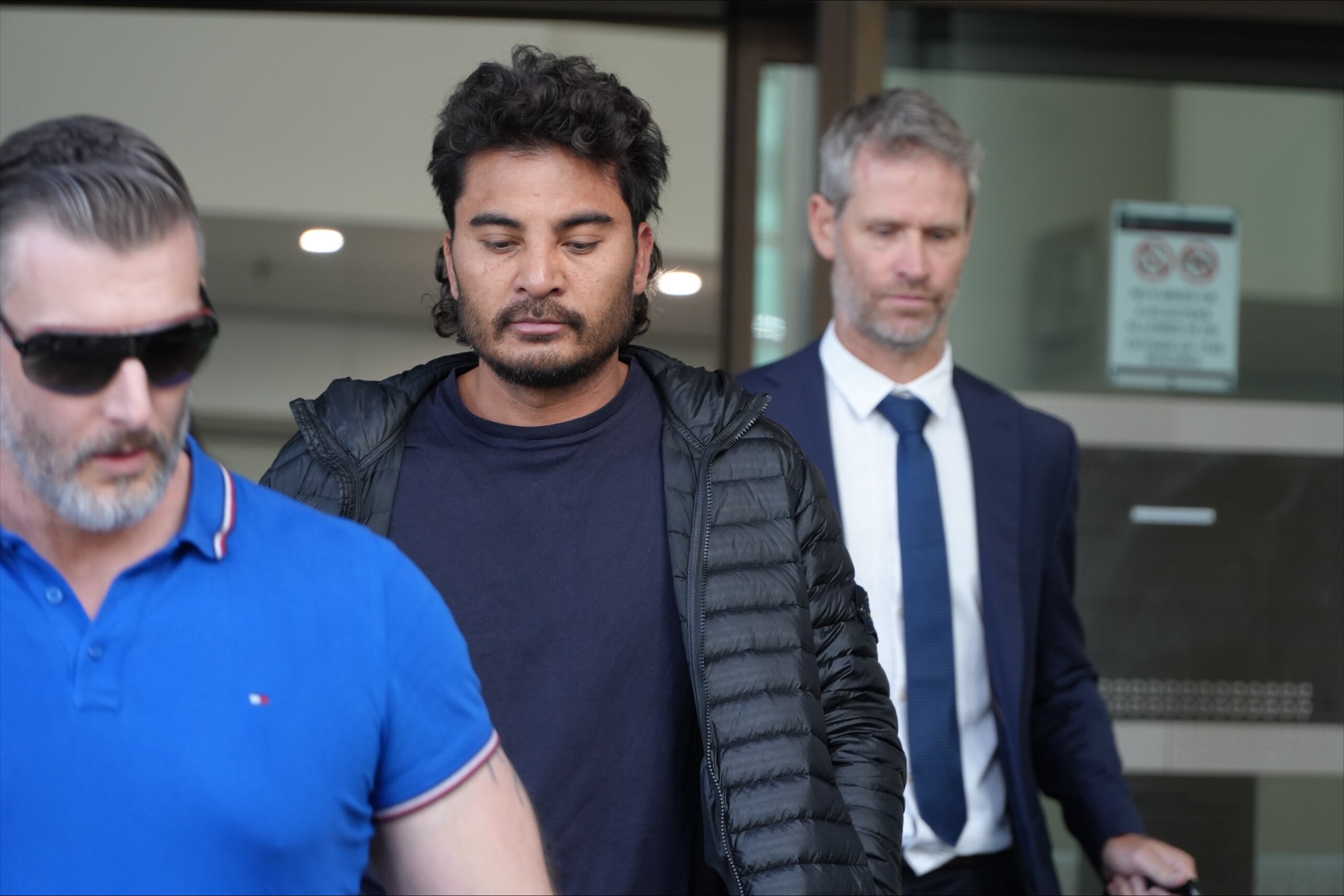 Laurence Escalante leaves court in Perth's CBD on Friday. - ABC News