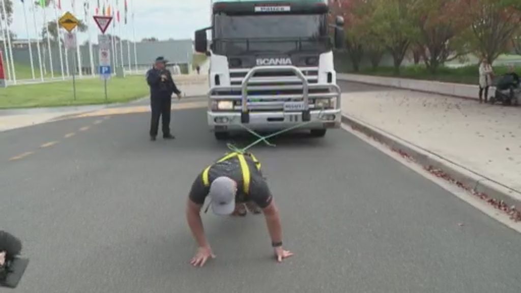 AFP commander and Australian strongman Grant Edwards pulls 190-tonne C ...