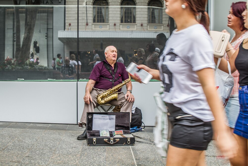 Brisbane's blind busker spreads Christmas cheer to frantic shoppers ...