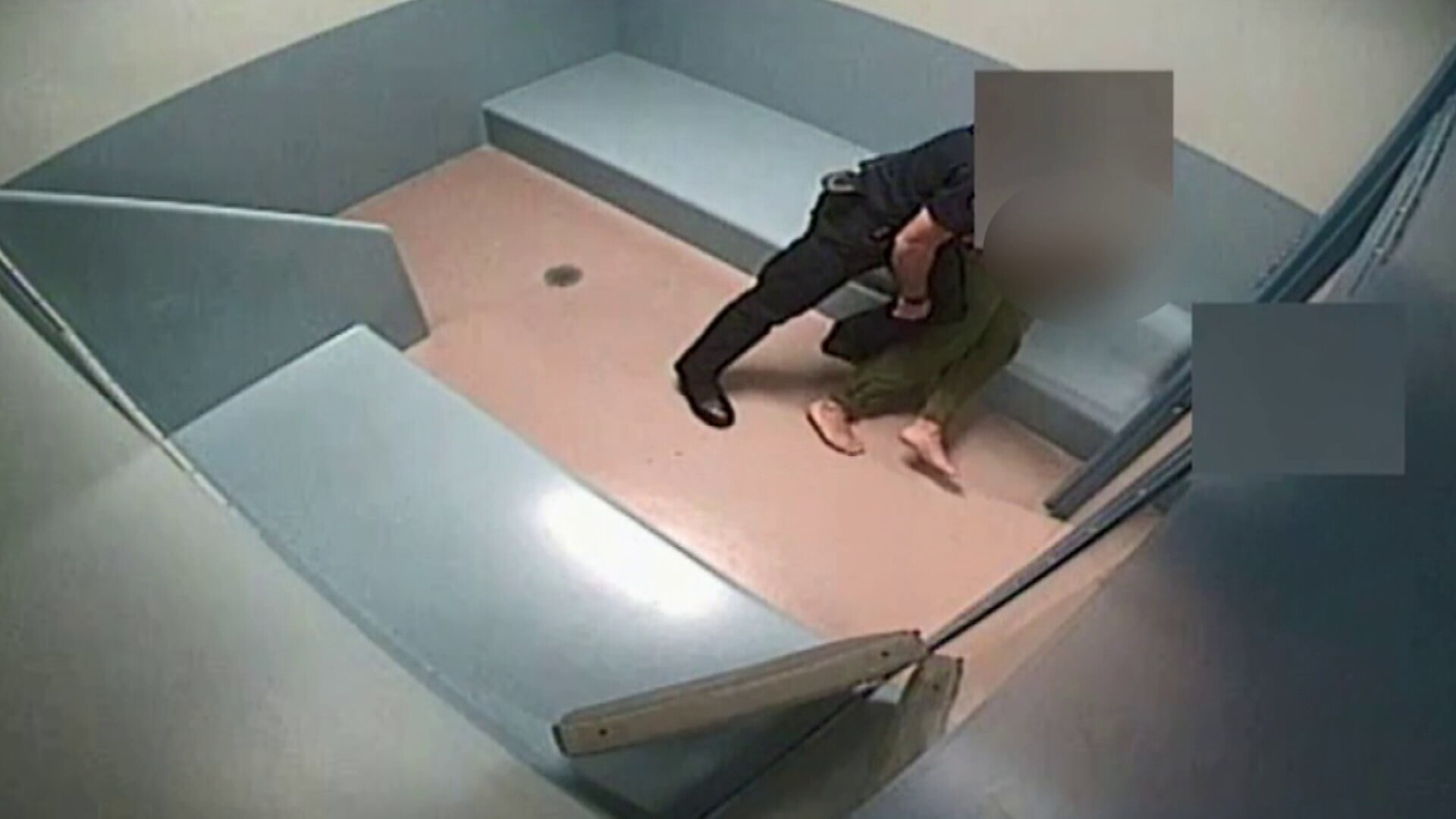 Jason is held down in a cell by police - ABC News