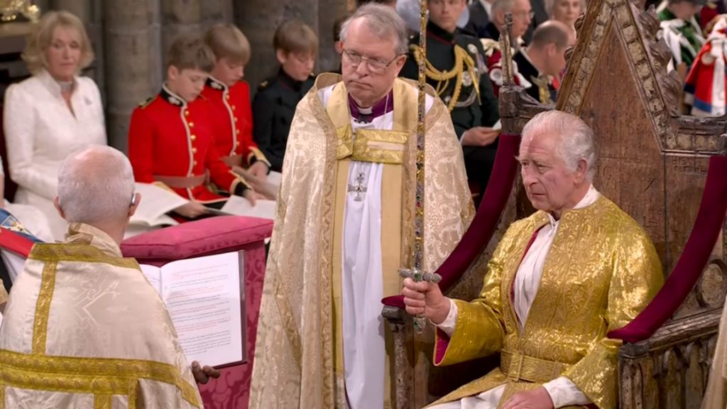 King Charles is adorned with the royal regalia - ABC News