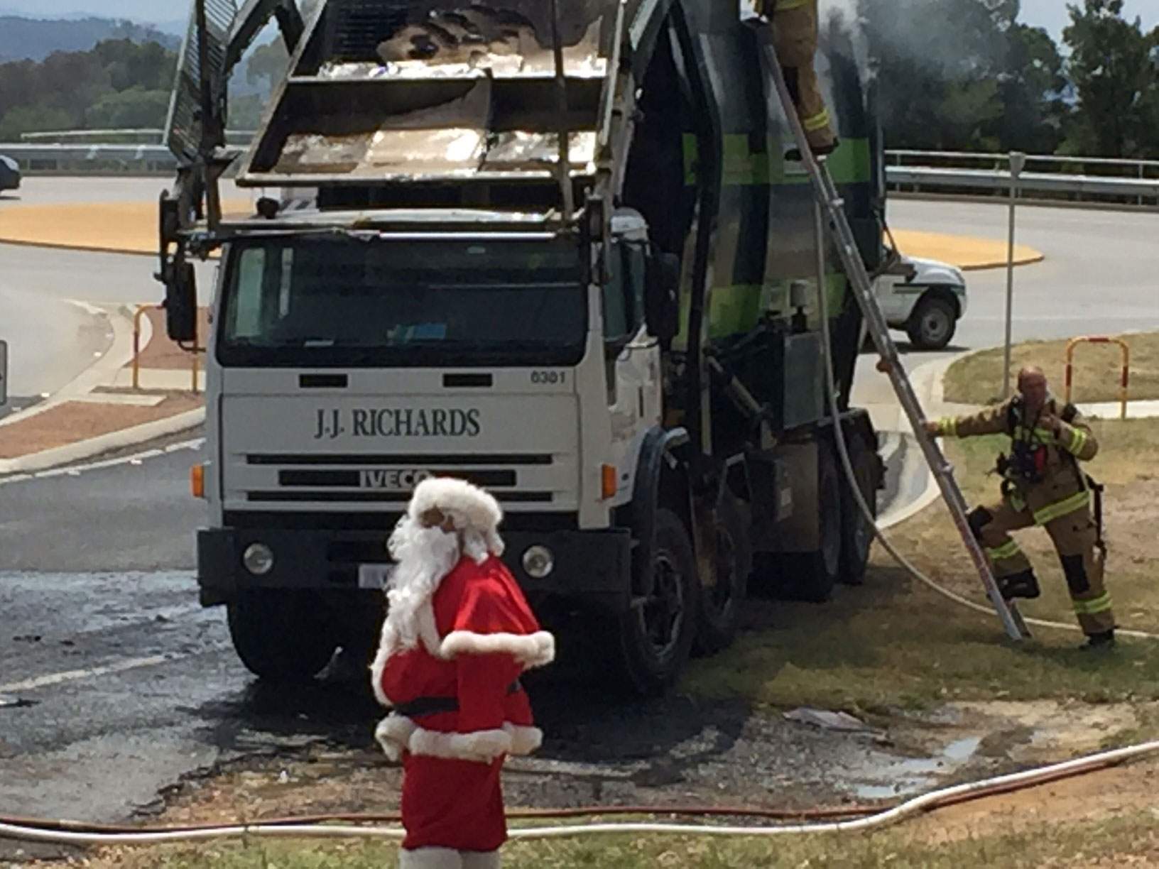 Santa flags down burning recycling truck in Queanbeyan - ABC News