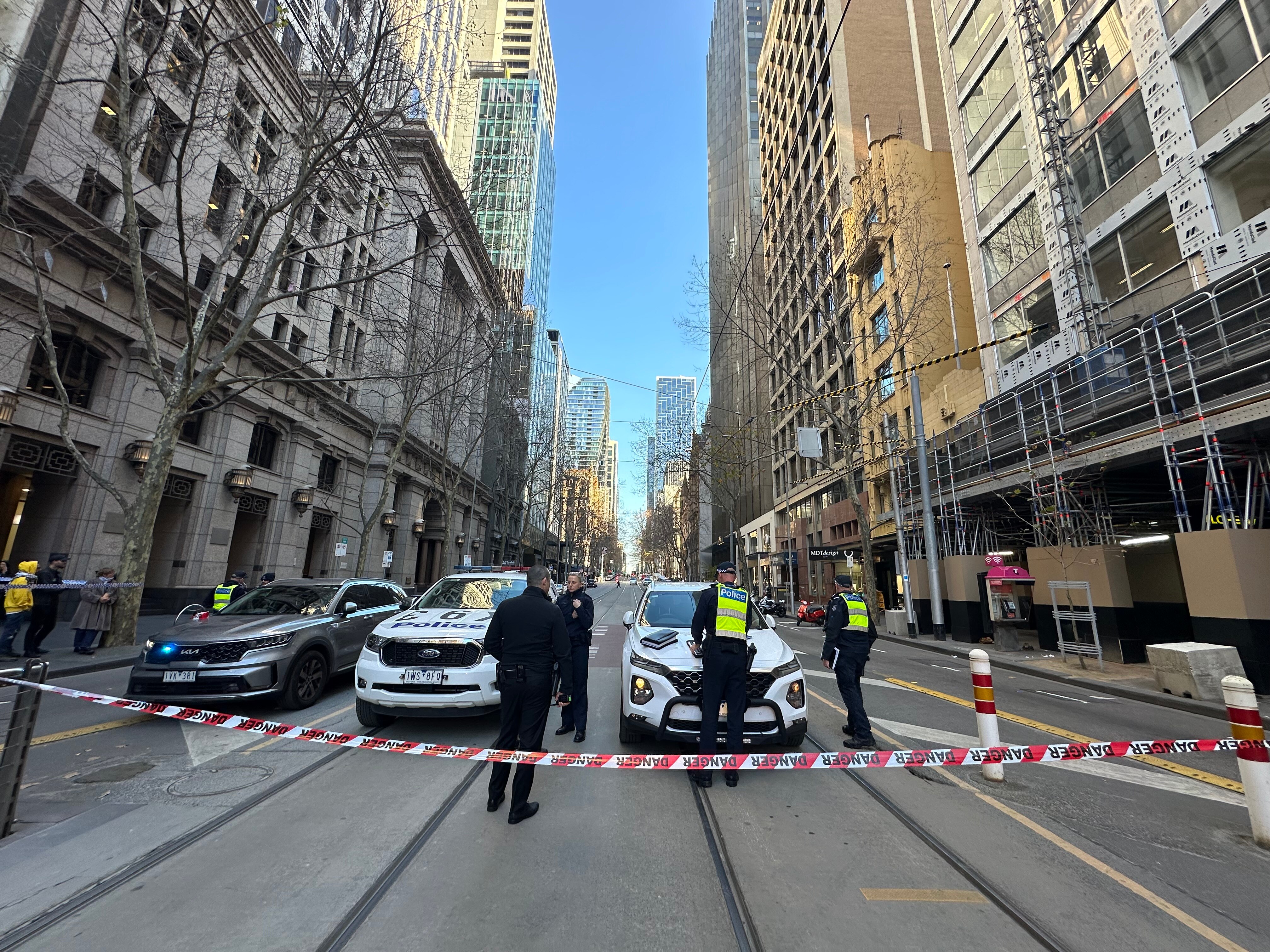 Man charged, bomb squad called after incident at Collins Street in ...