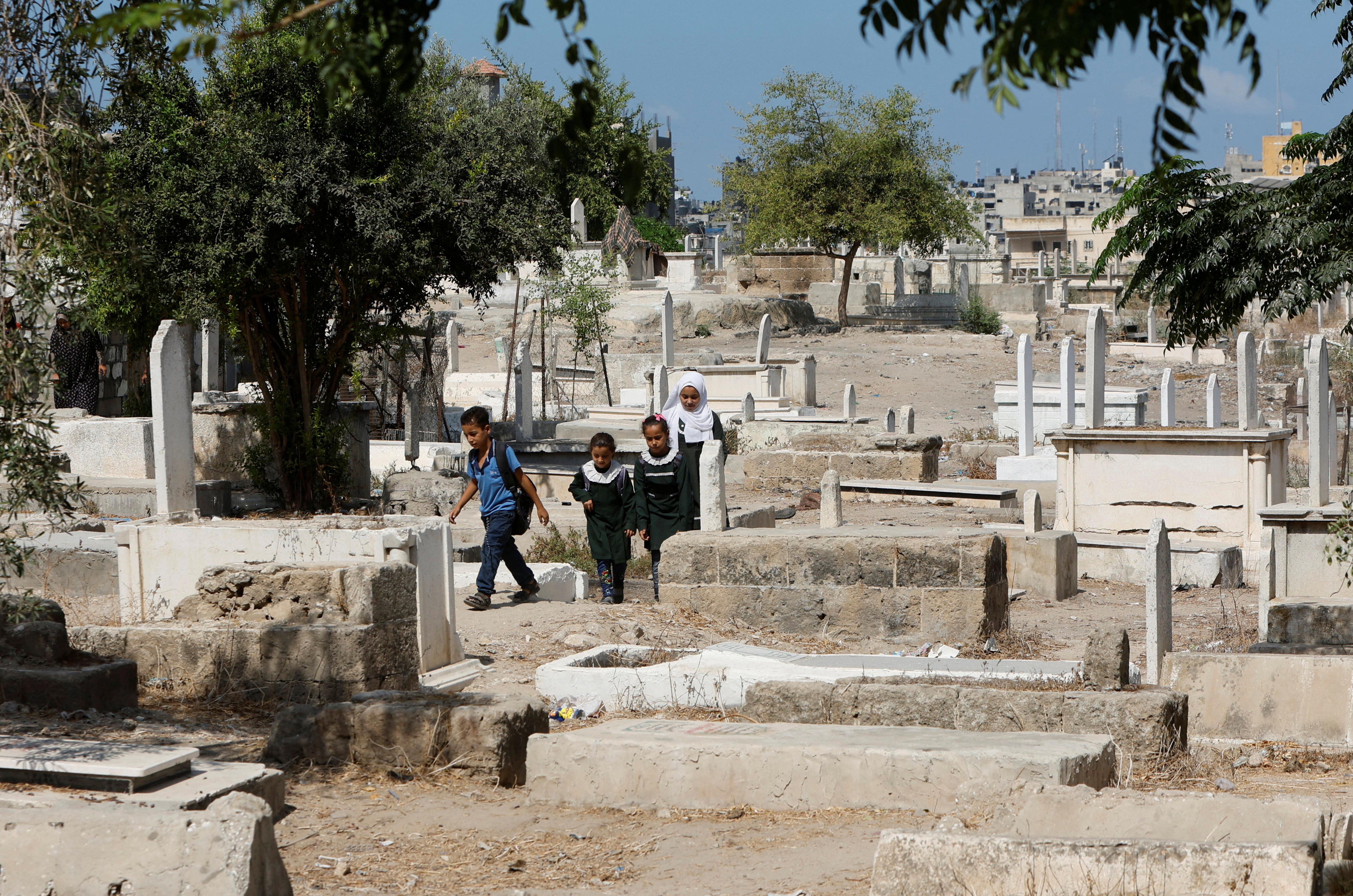 Authorities say cemeteries are full as families build homes among ...