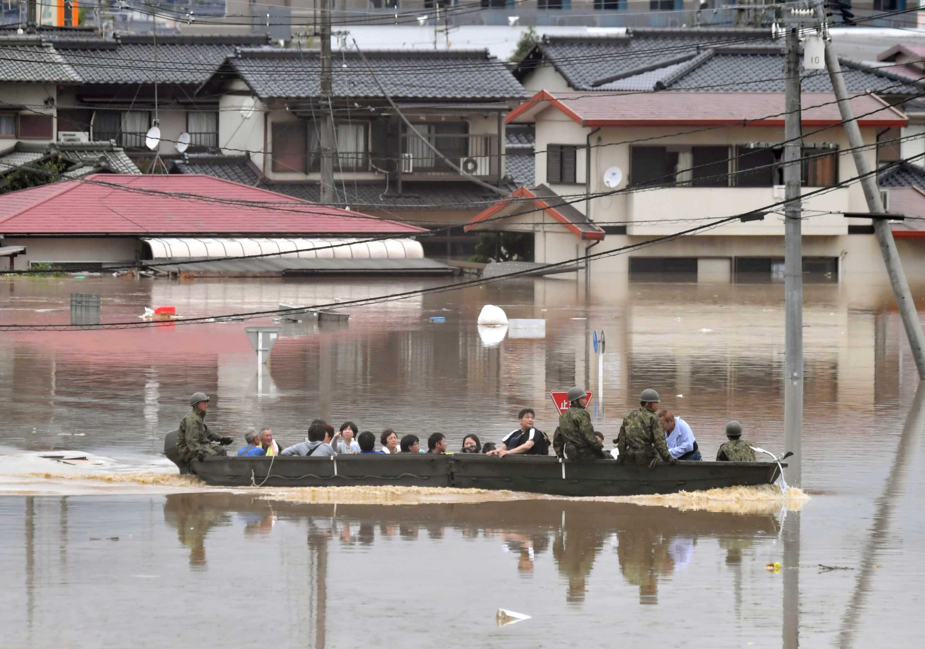 Japan flooding and landslides kill dozens as millions are ordered to ...