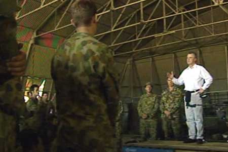 Nelson defends E Timor troop wages - ABC News