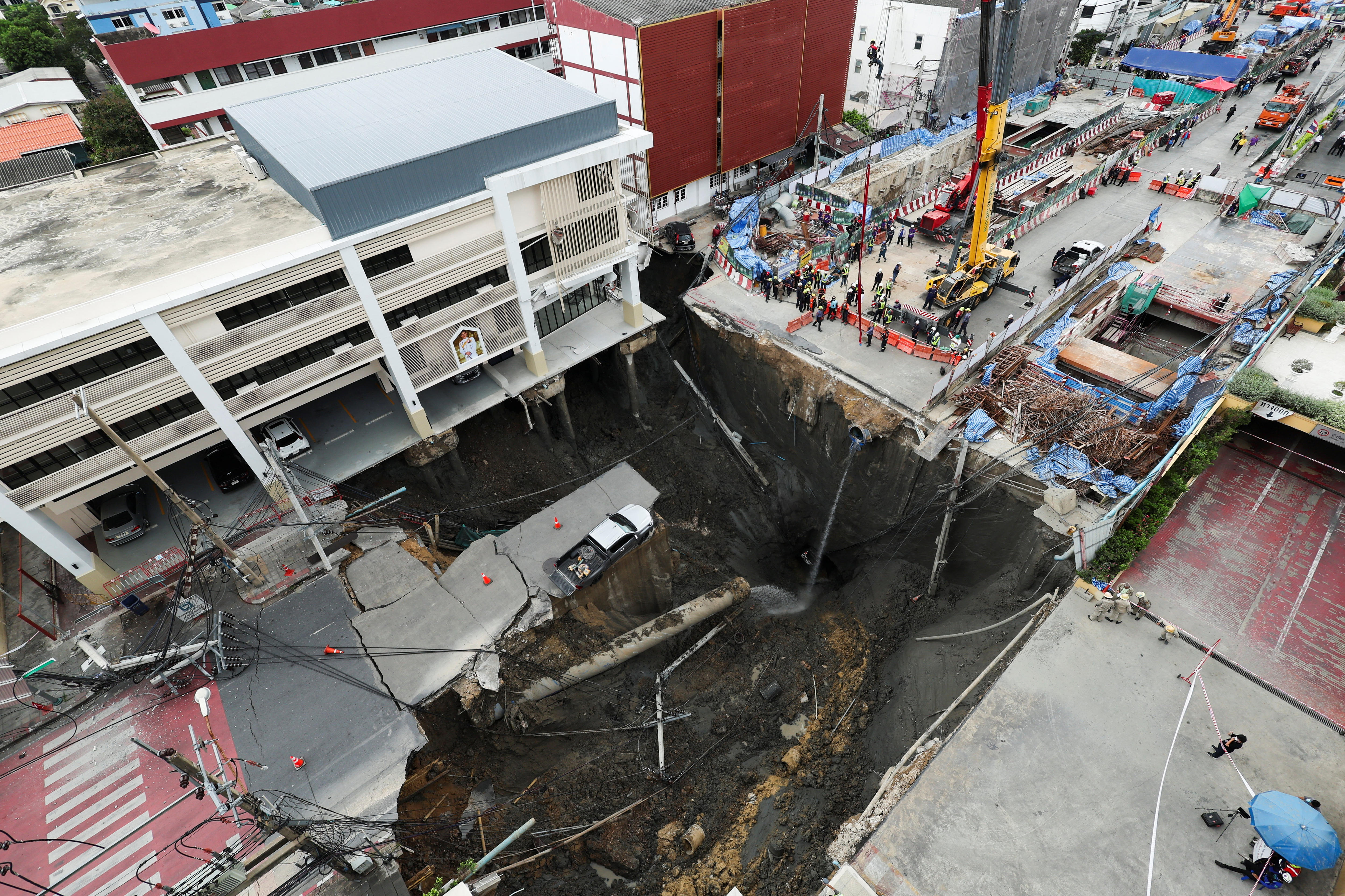 Dramatic footage shows sinkhole swallowing up road in central Bangkok