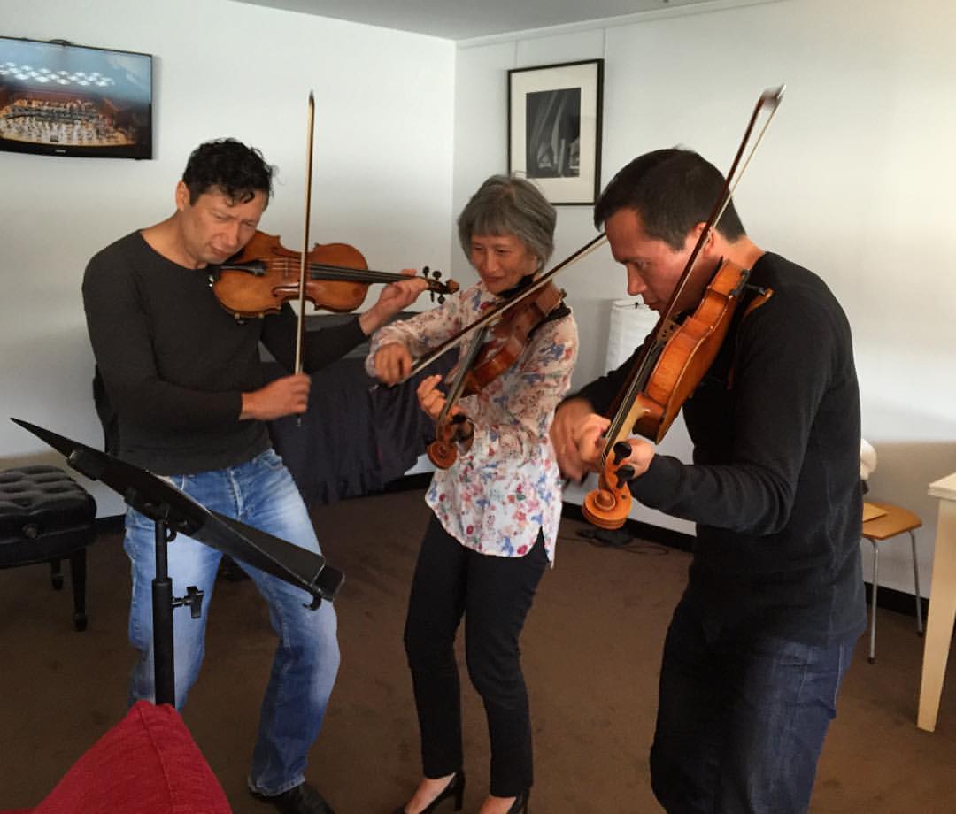 Violin virtuoso siblings perform together for first time in 25 years at ...
