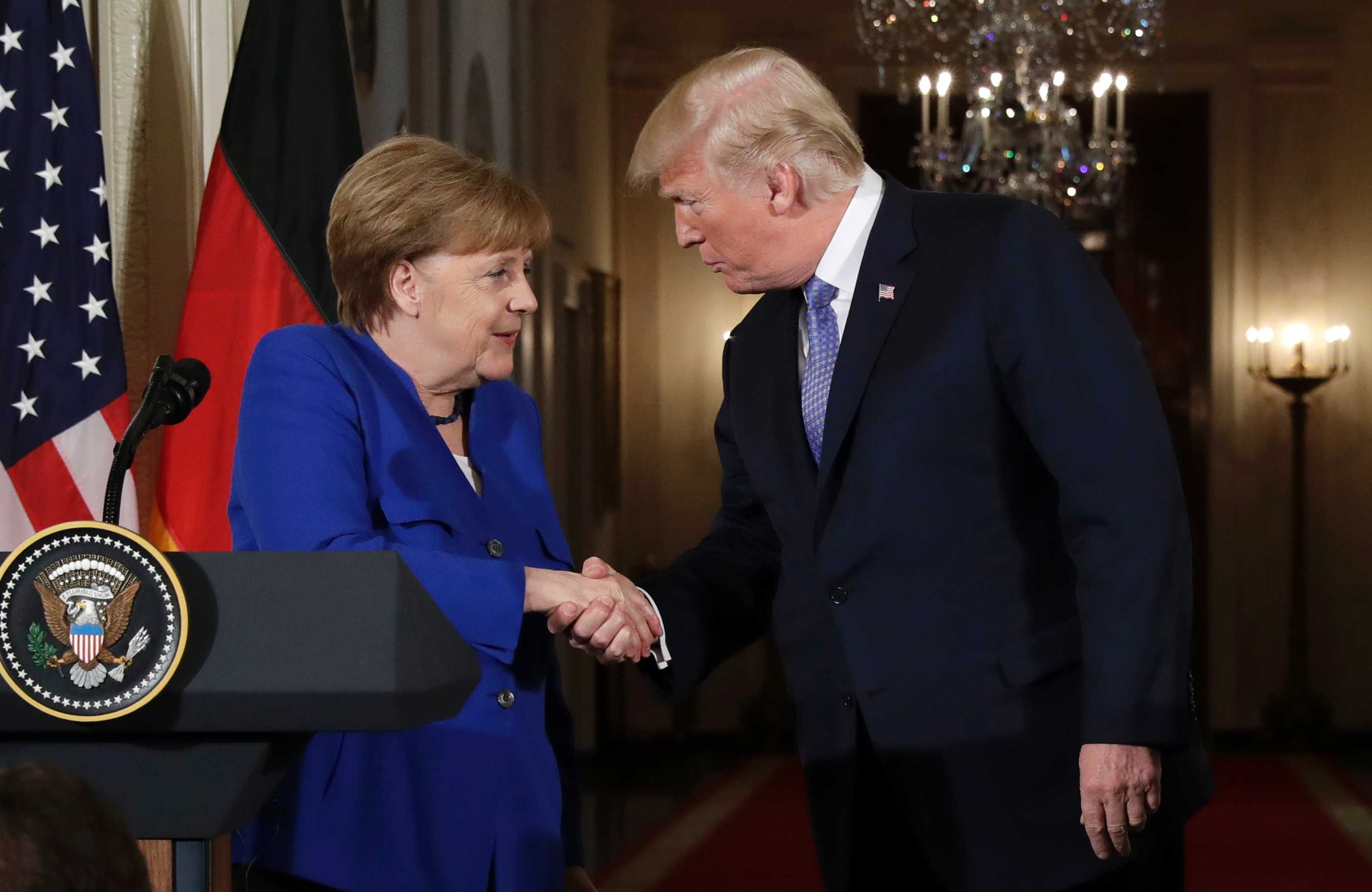 Trump and Merkel talk Iran and trade, shake hands in Washington - ABC News