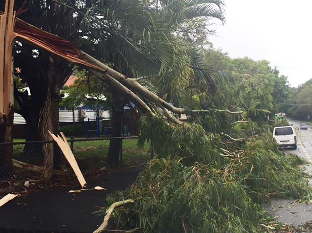 Queensland storms: Wind and rain tears across coastal cities, with more ...