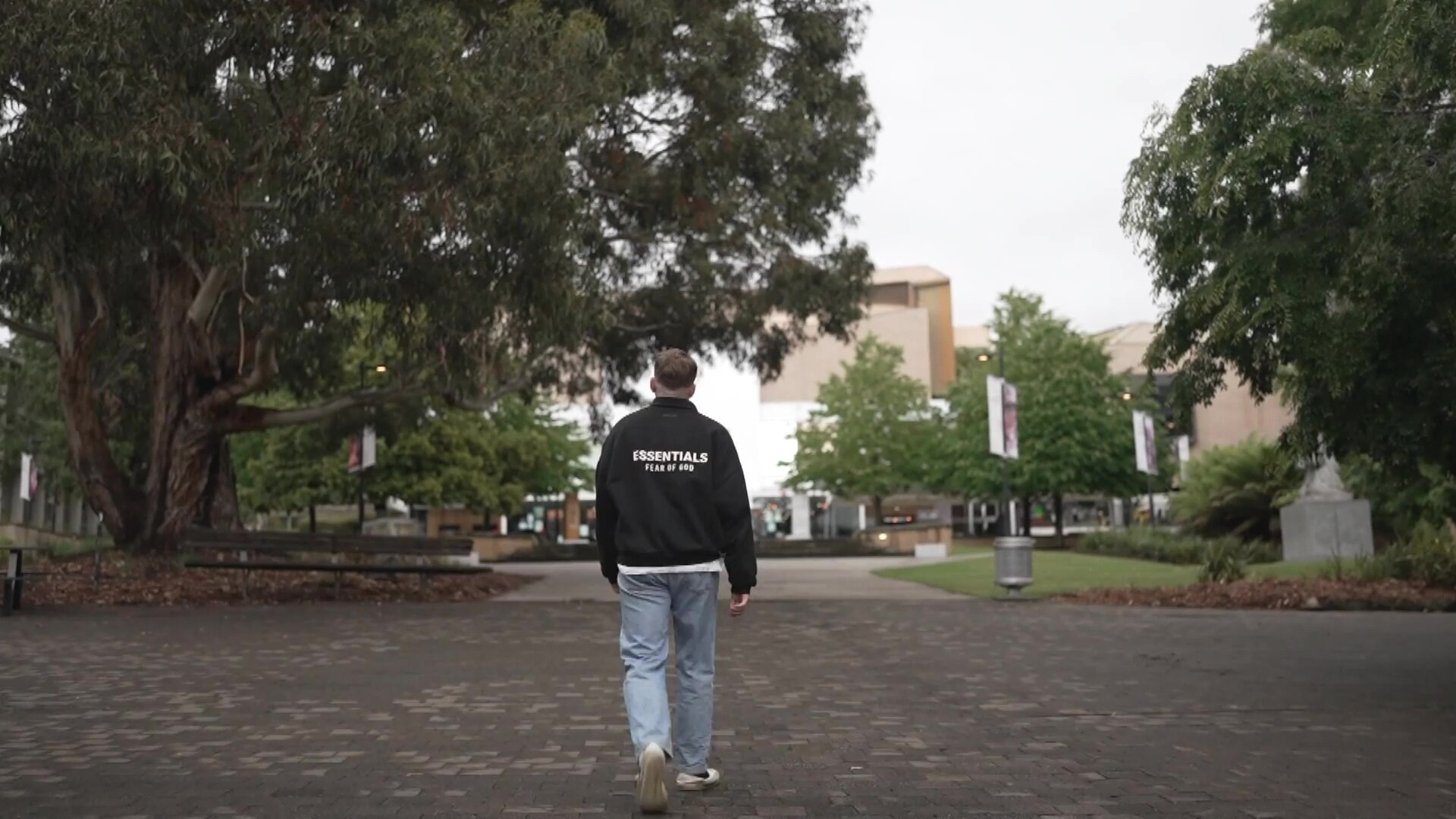 Elijah walks through the UTAS Sandy Bay campus - ABC News