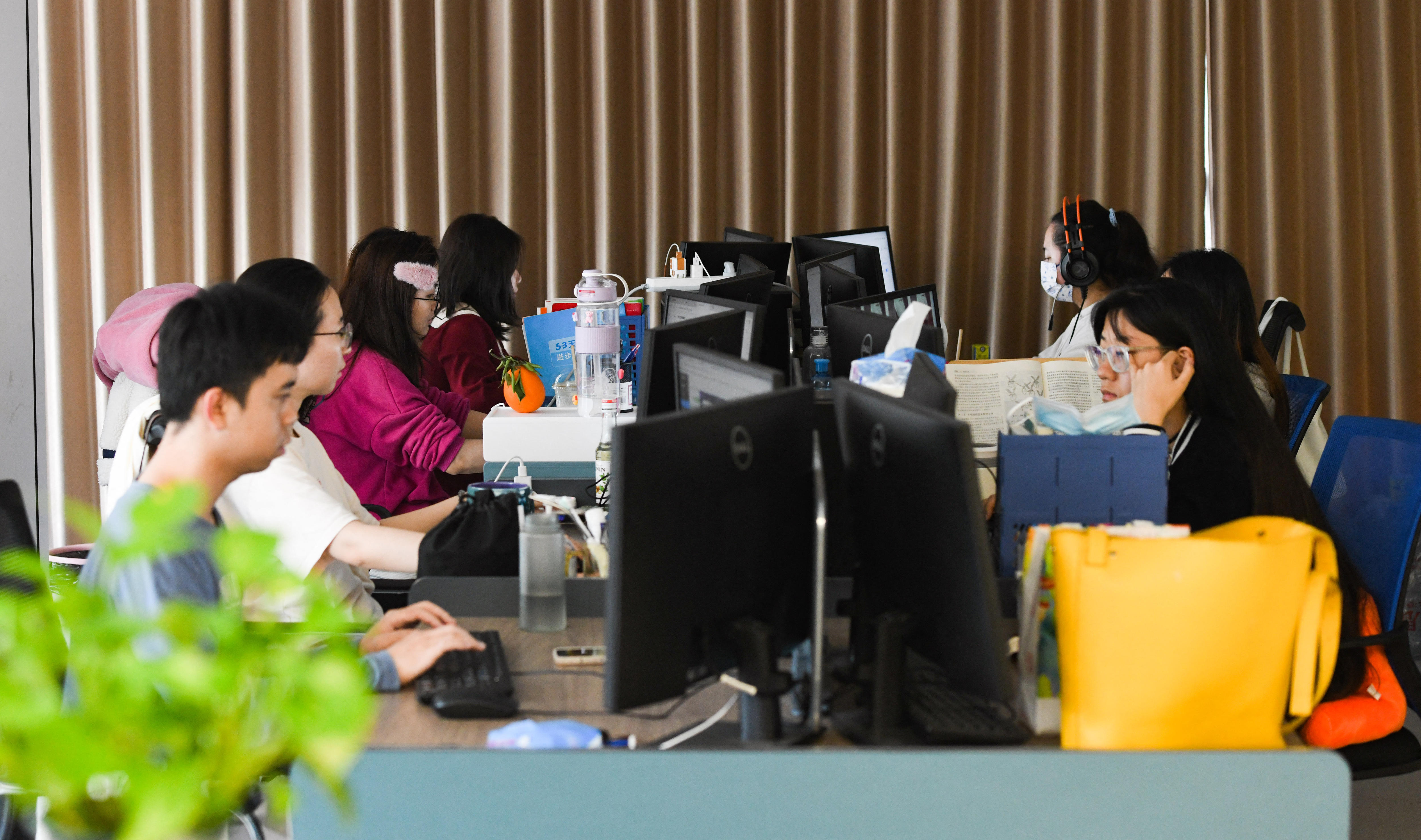 China is considering making bosses pay workers for 'invisible' overtime ...