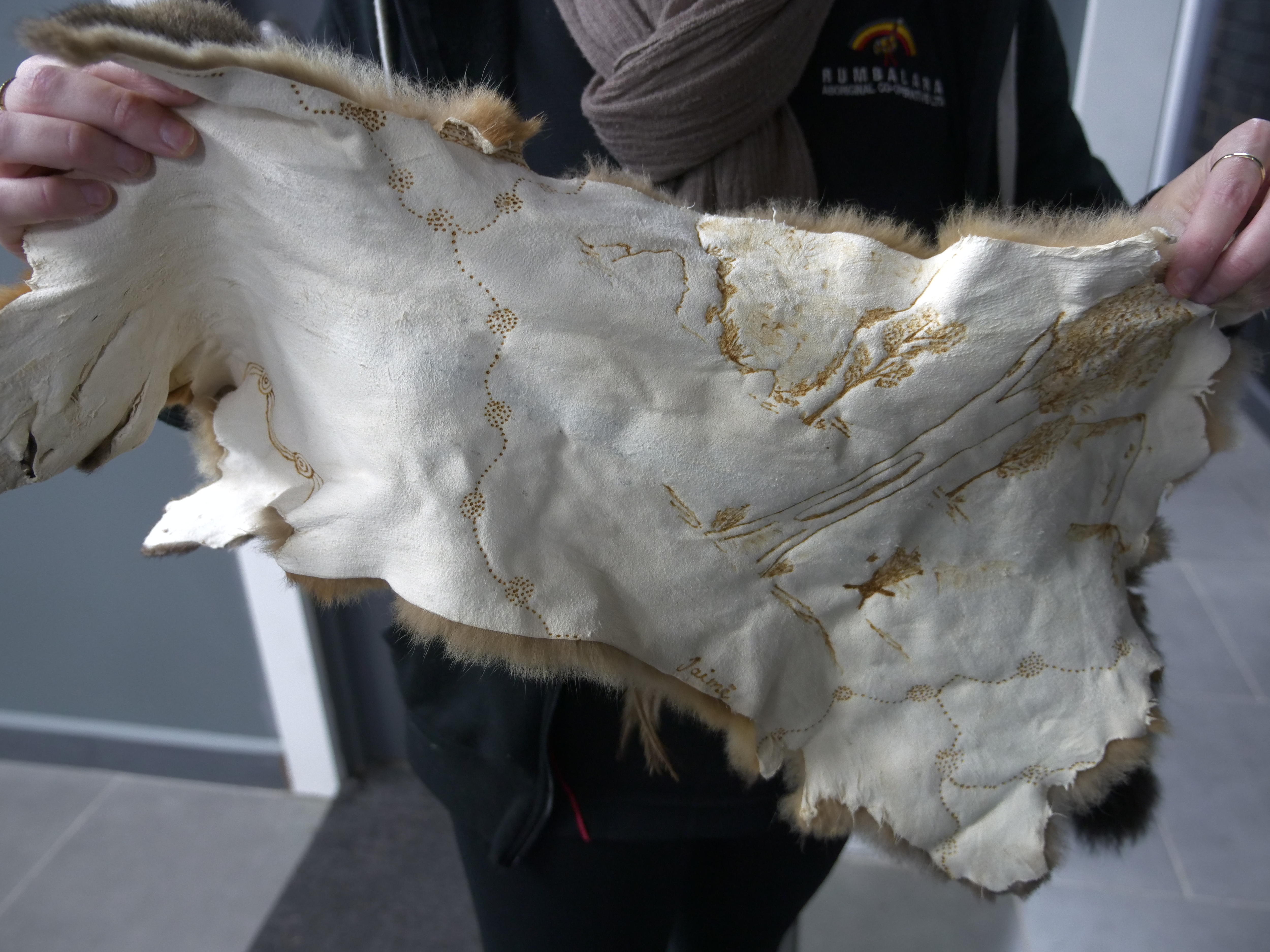 Indigenous young people make possum skin cloak to help elders with safe passage to the Dreamtime ...