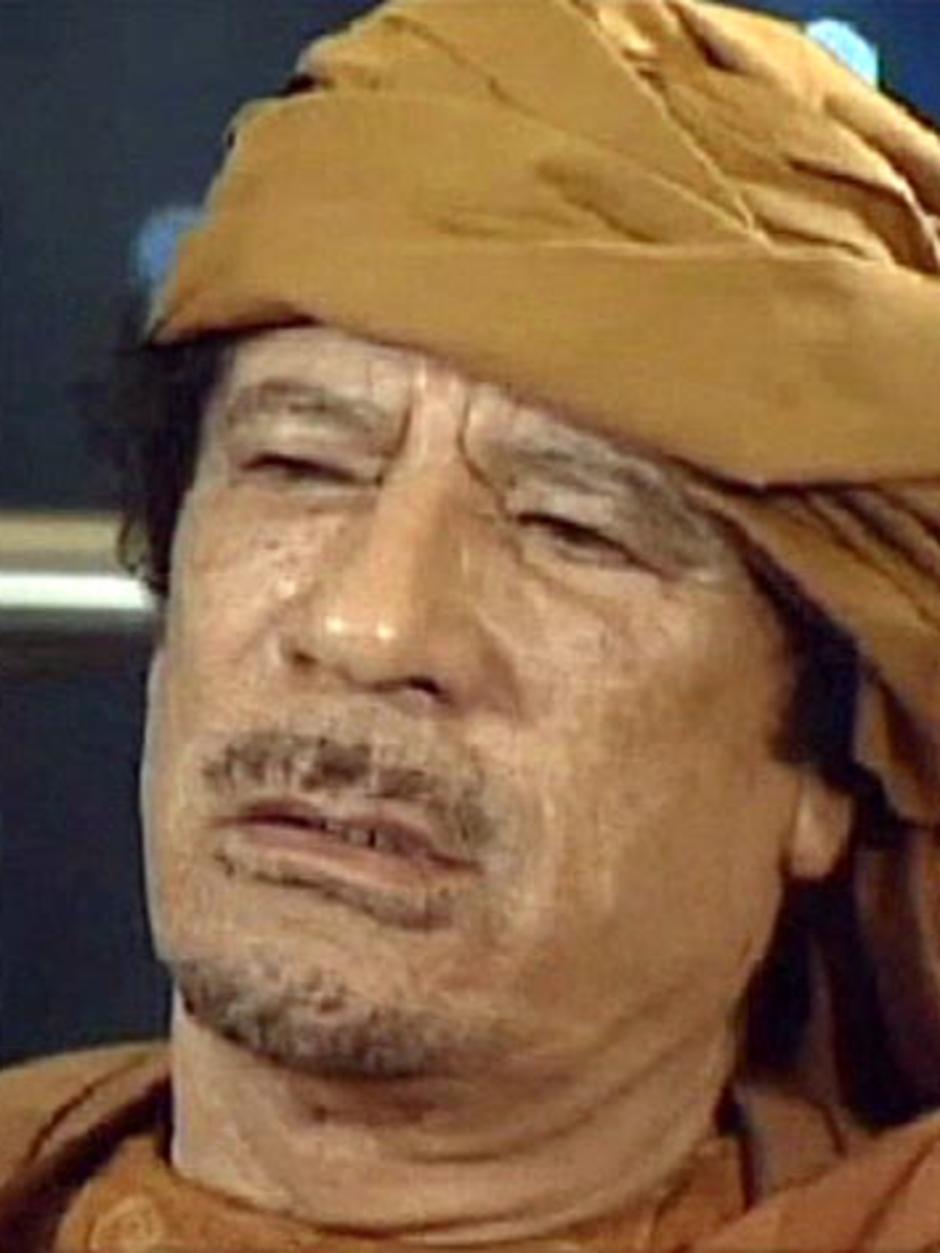 Interpol issues global alert again Gadaffi - ABC listen