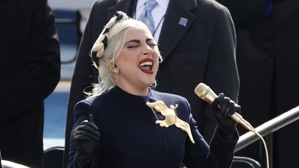Lady Gaga performs the US national anthem at the inauguration ceremony ...