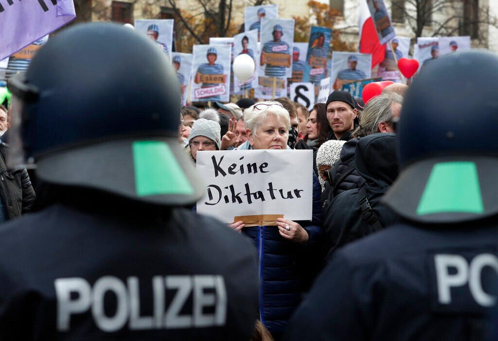 German anti-lockdown protester confronted after she compared herself to ...