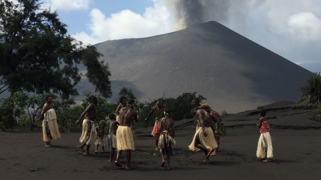 A local Tanna tribe at Mt Yasur perform a kastom war song and dance for ...