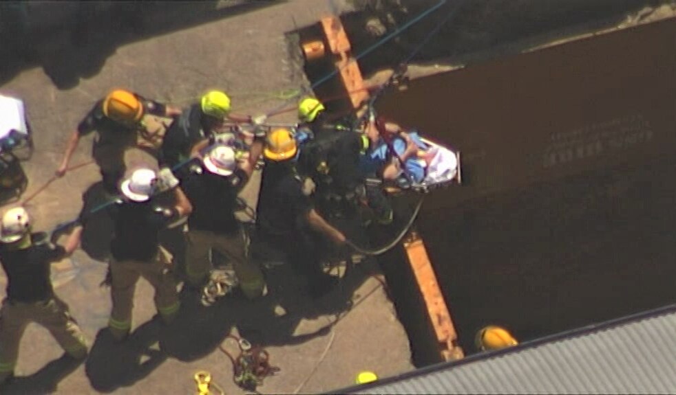 Man rescued after falling down 6 metre hole at Brisbane construction ...