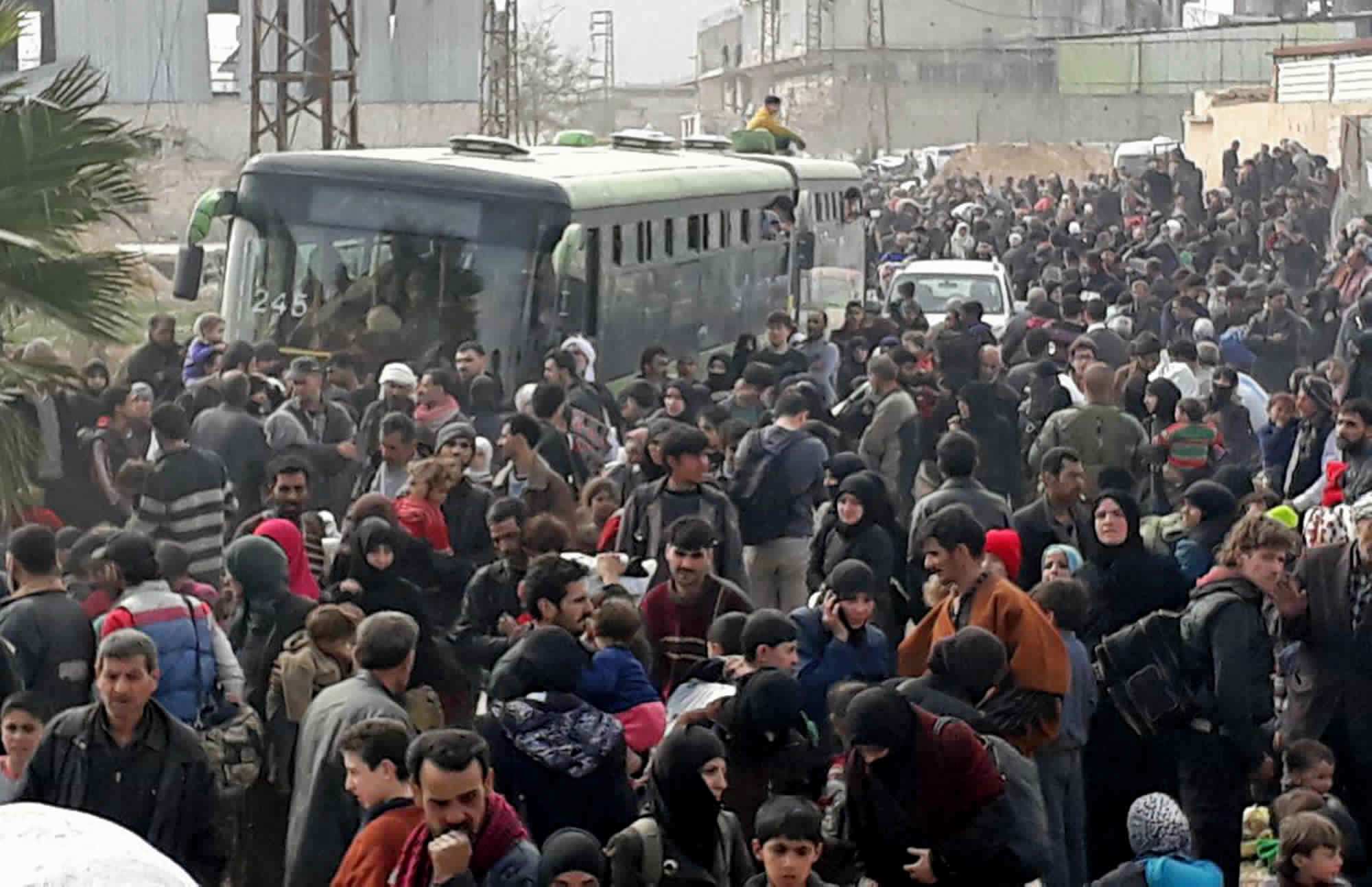 Thousands flee in first mass exodus from Syria's besieged eastern ...