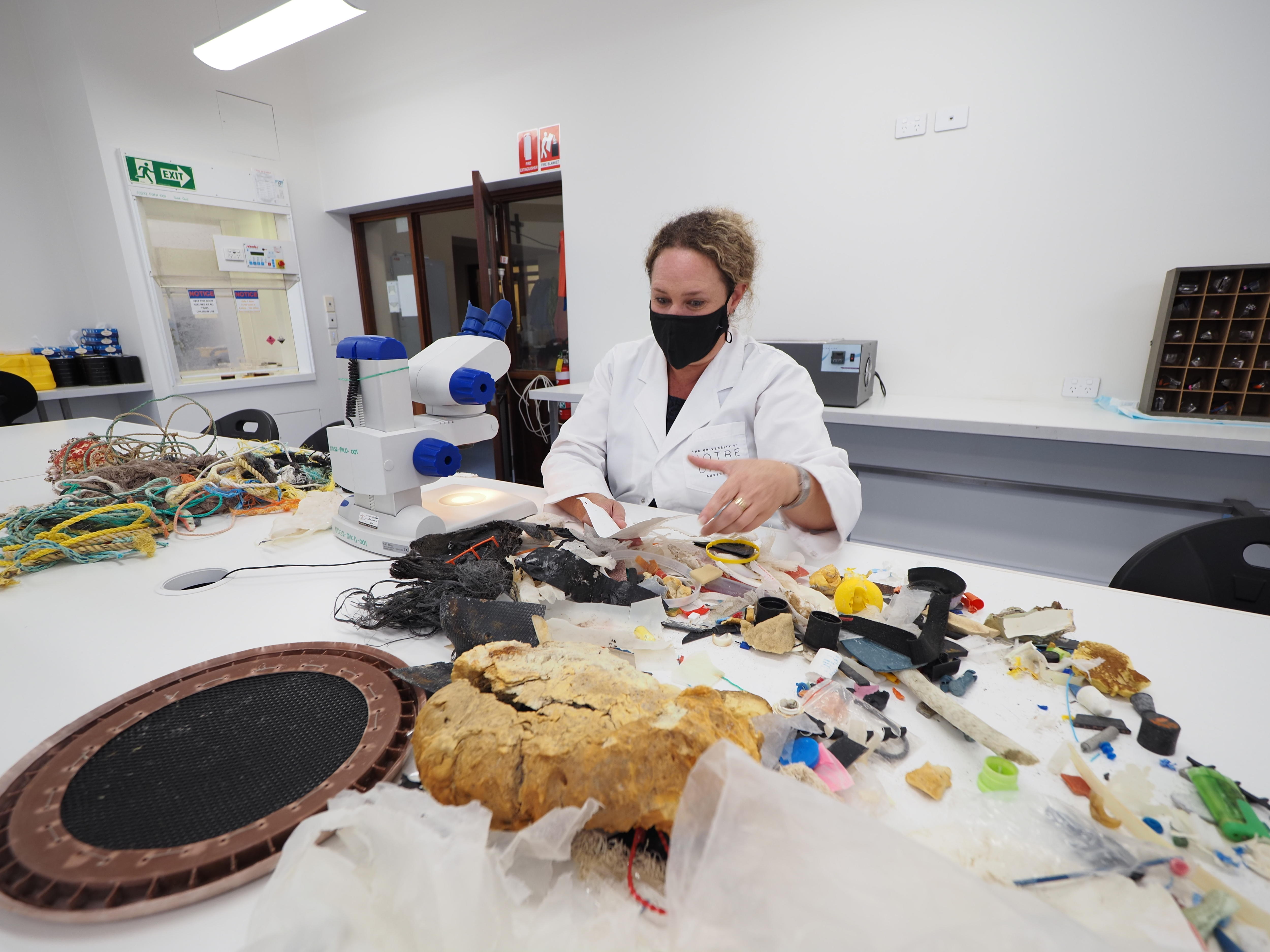Decades-old rubbish washes up at Bathers Beach south of Perth as ...