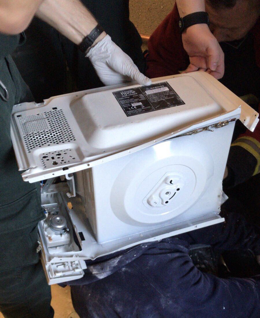 Firefighters remove man's head from microwave after YouTube prank goes ...