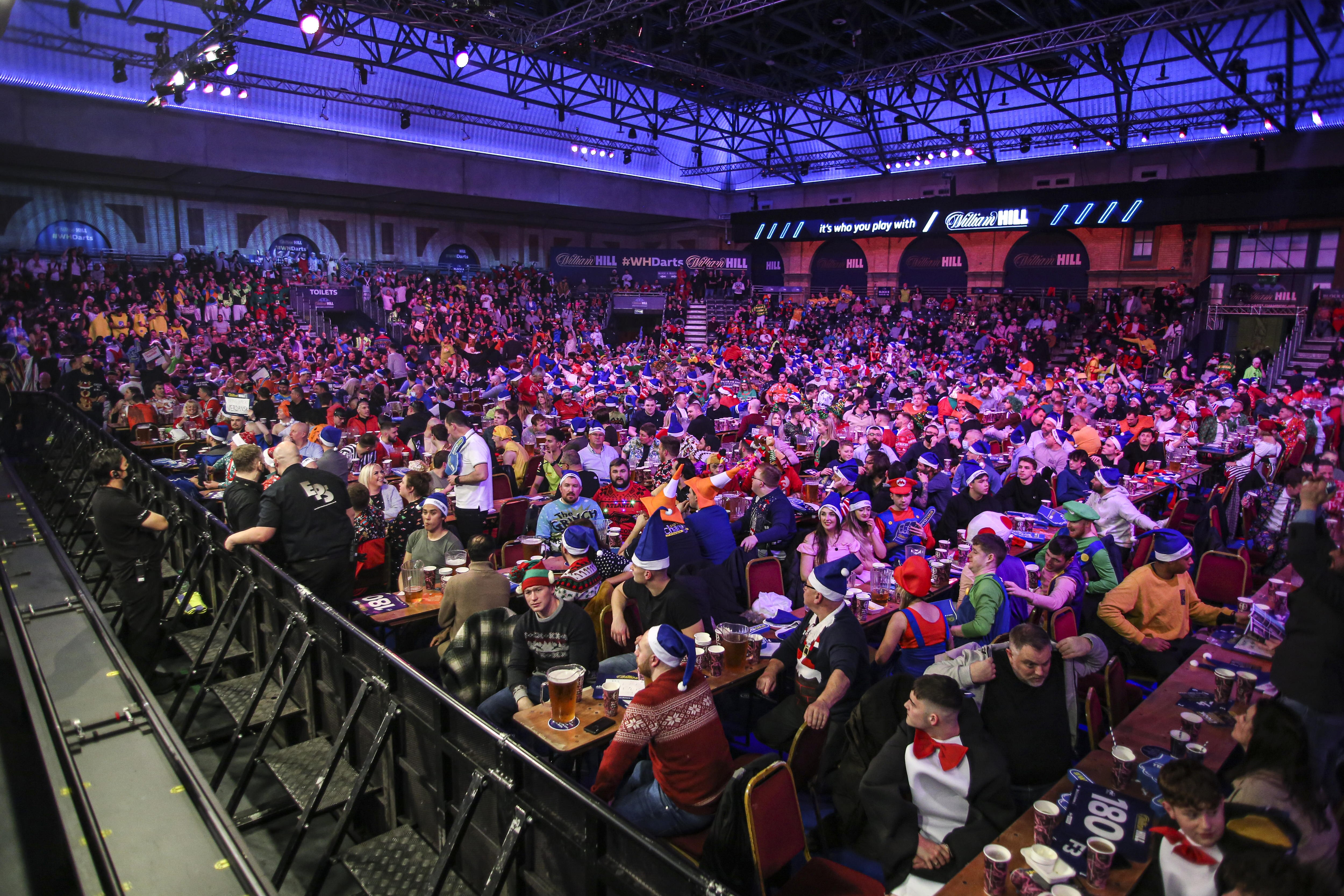 Aussie darts dad through to next round of world championships, awaits ...