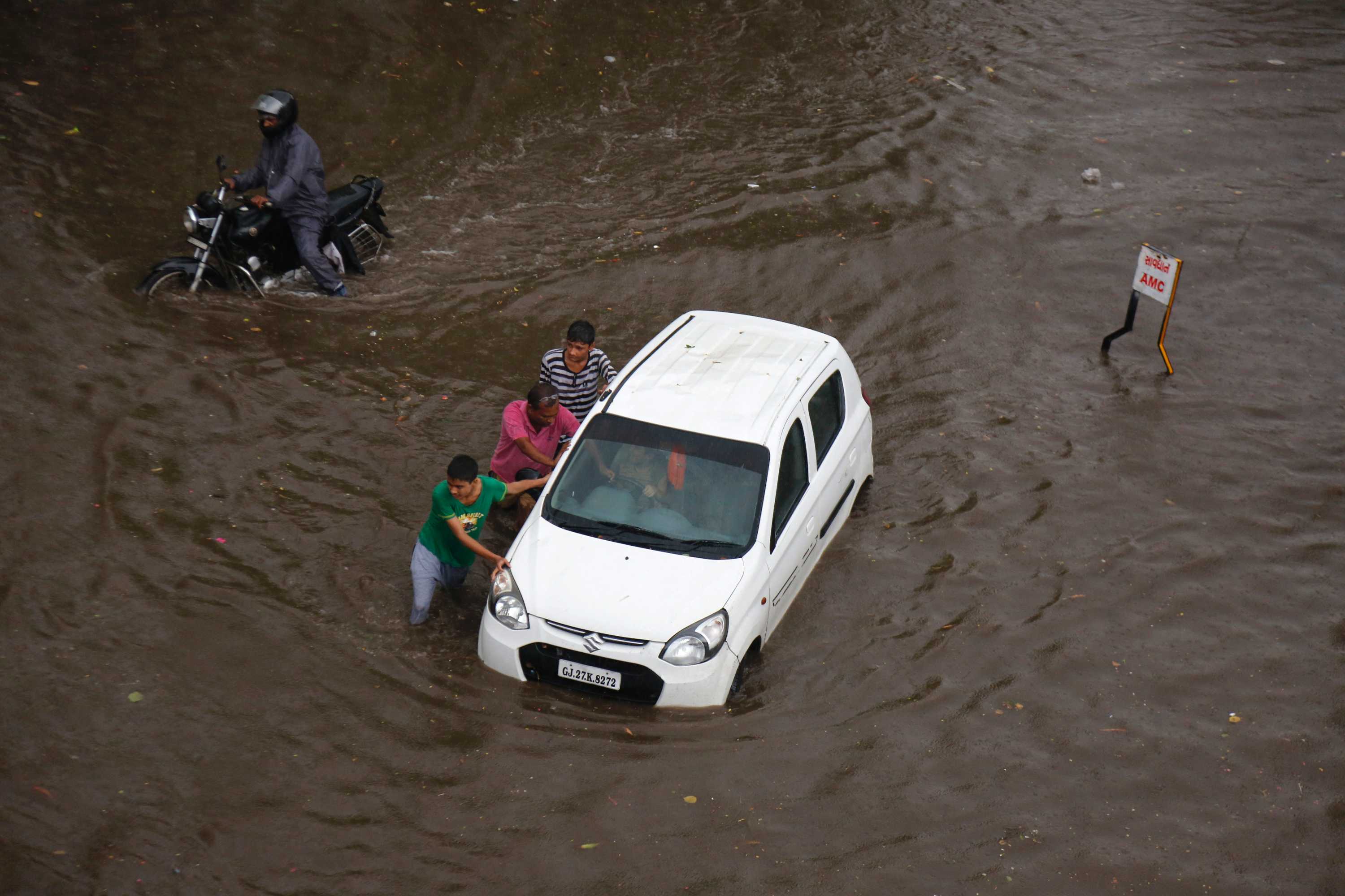 Monsoon rains kill 58 in India, as buildings collapse and streets flood ...