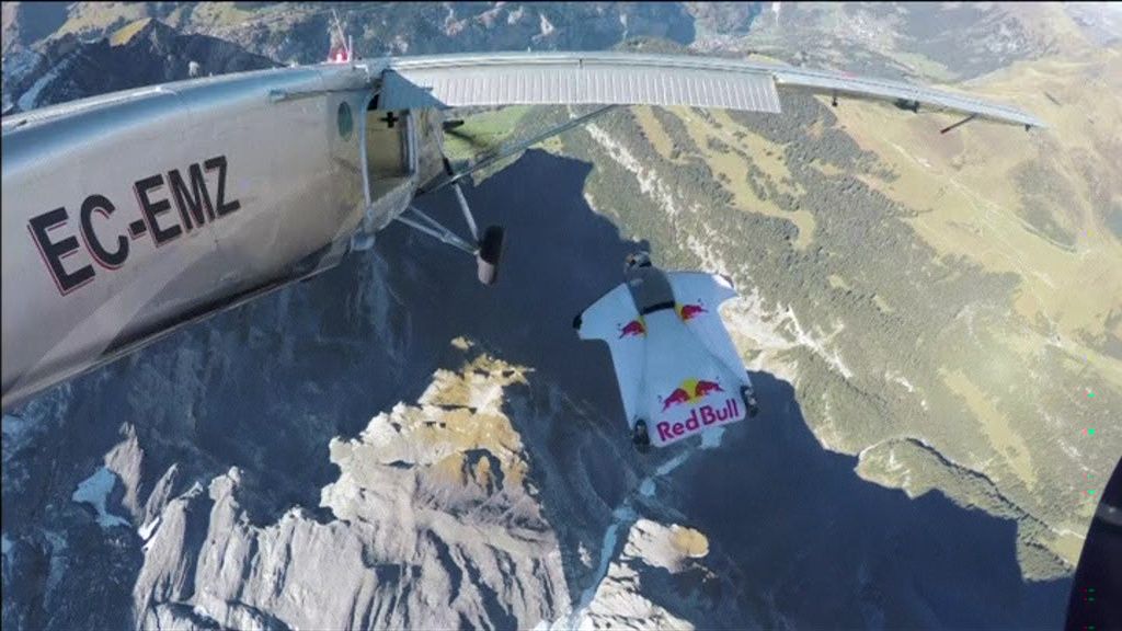 Wingsuit fliers jump into plane flying over Swiss Alps - ABC News